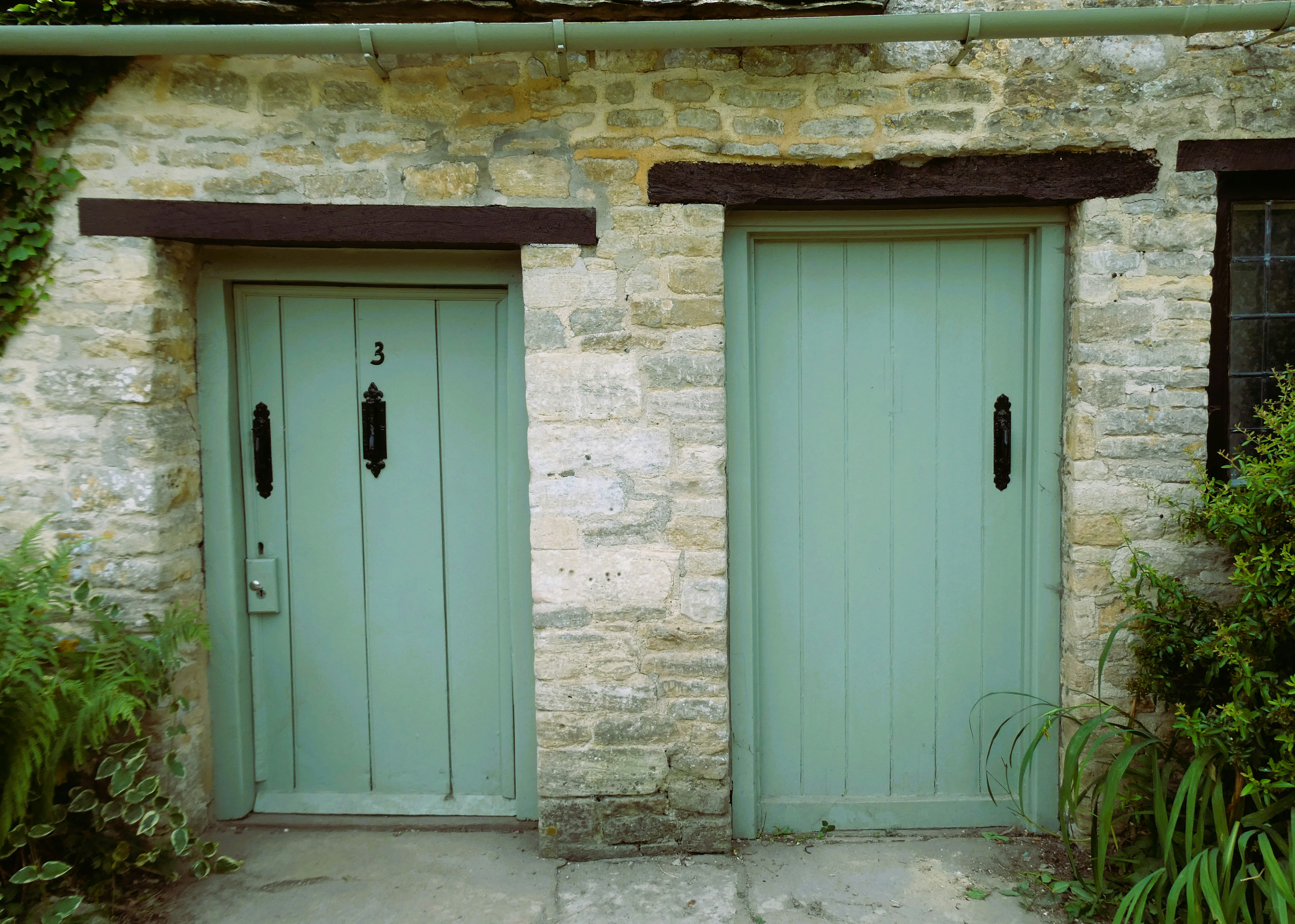 Two Aged Doors in a Stone Terrace
