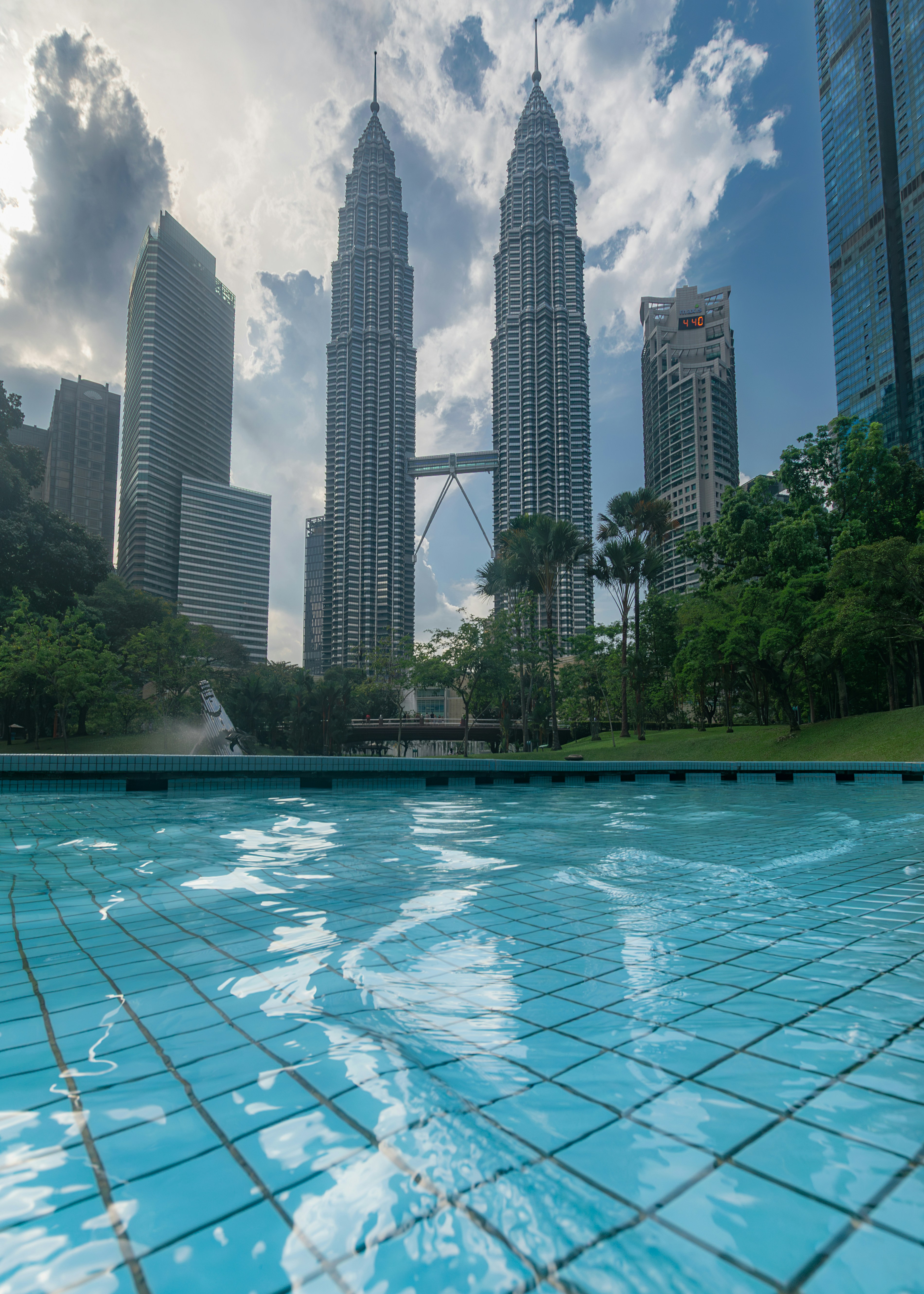 Skyline Reflections: Kuala Lumpur’s Twin Peaks above a Quiet Pool