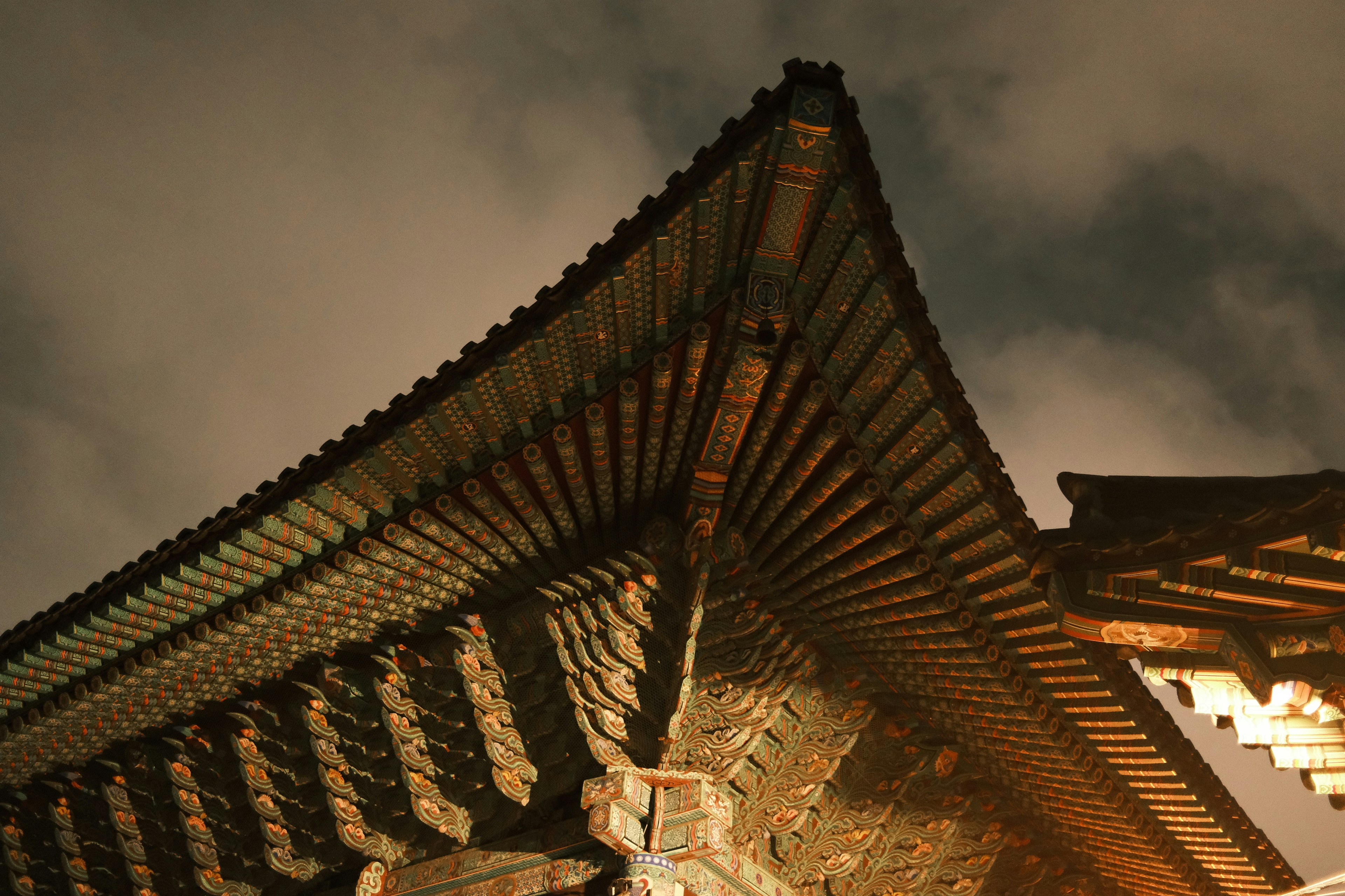 Roof Beams in Moonlit Craft: An Upward View of a Traditional Eaves