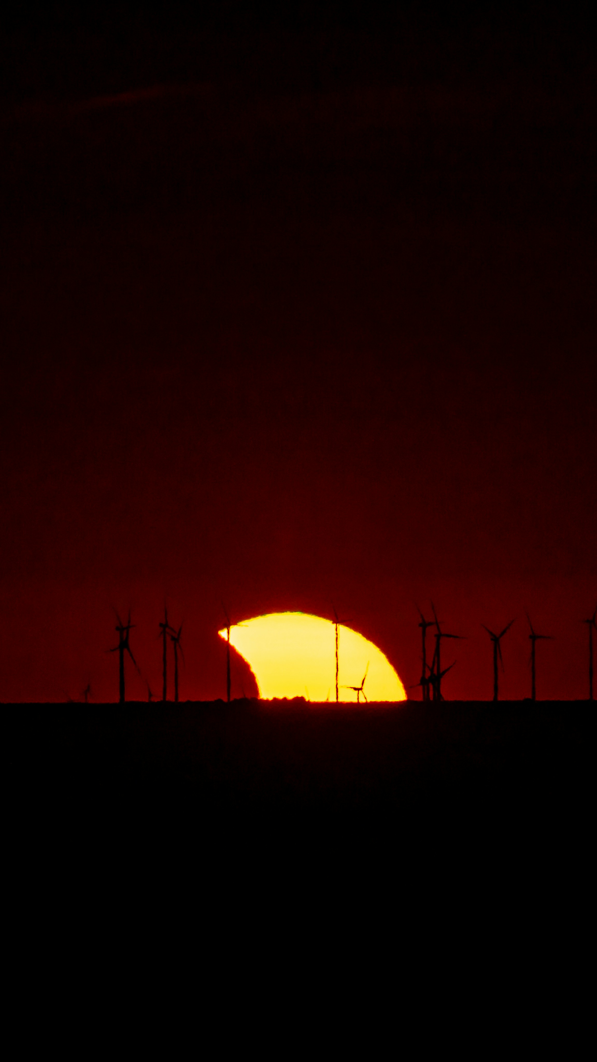 Half-Sun on the Wind-Turbine Ridge