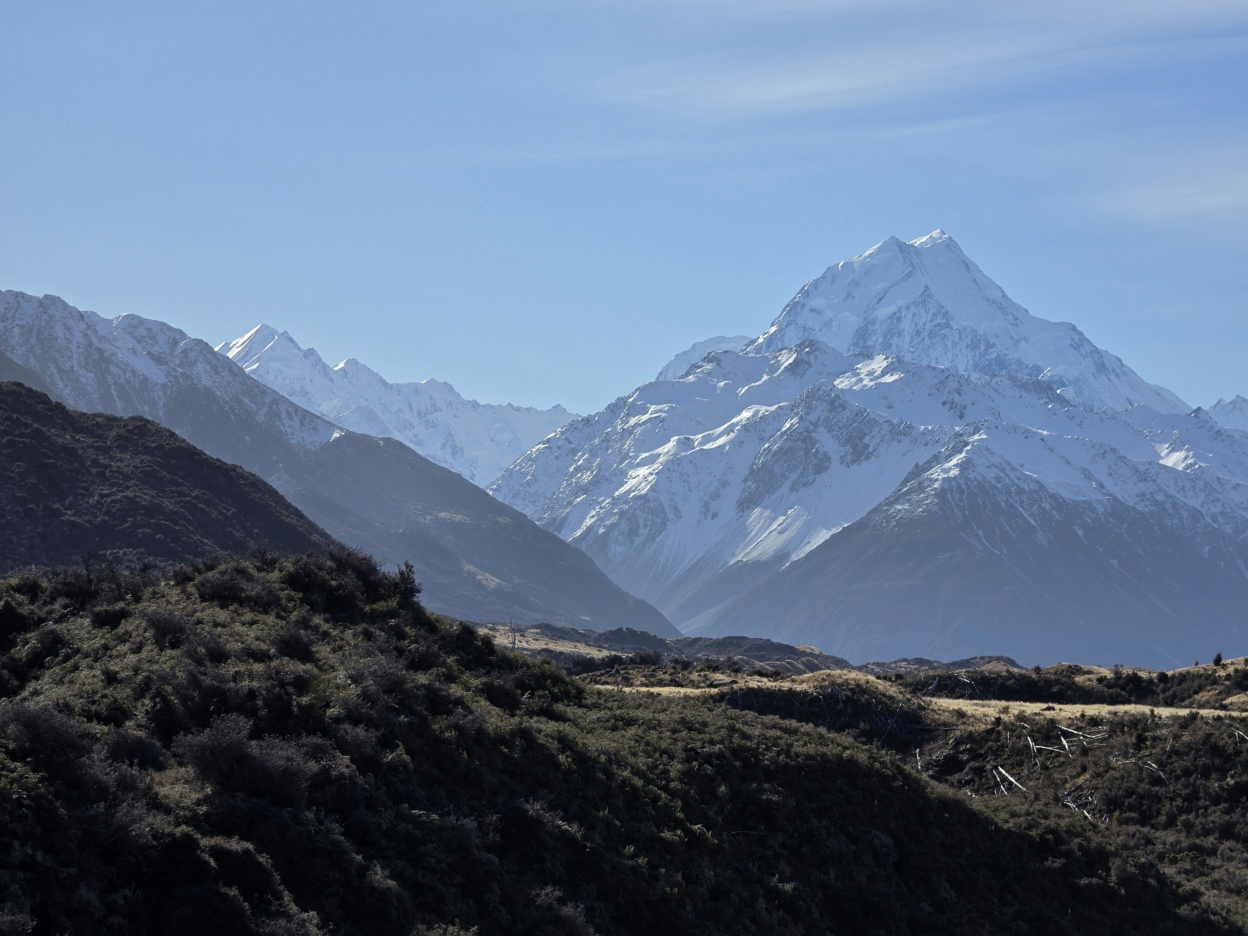 Snowbound Sentinel: A Mountain Crest Toward the Light