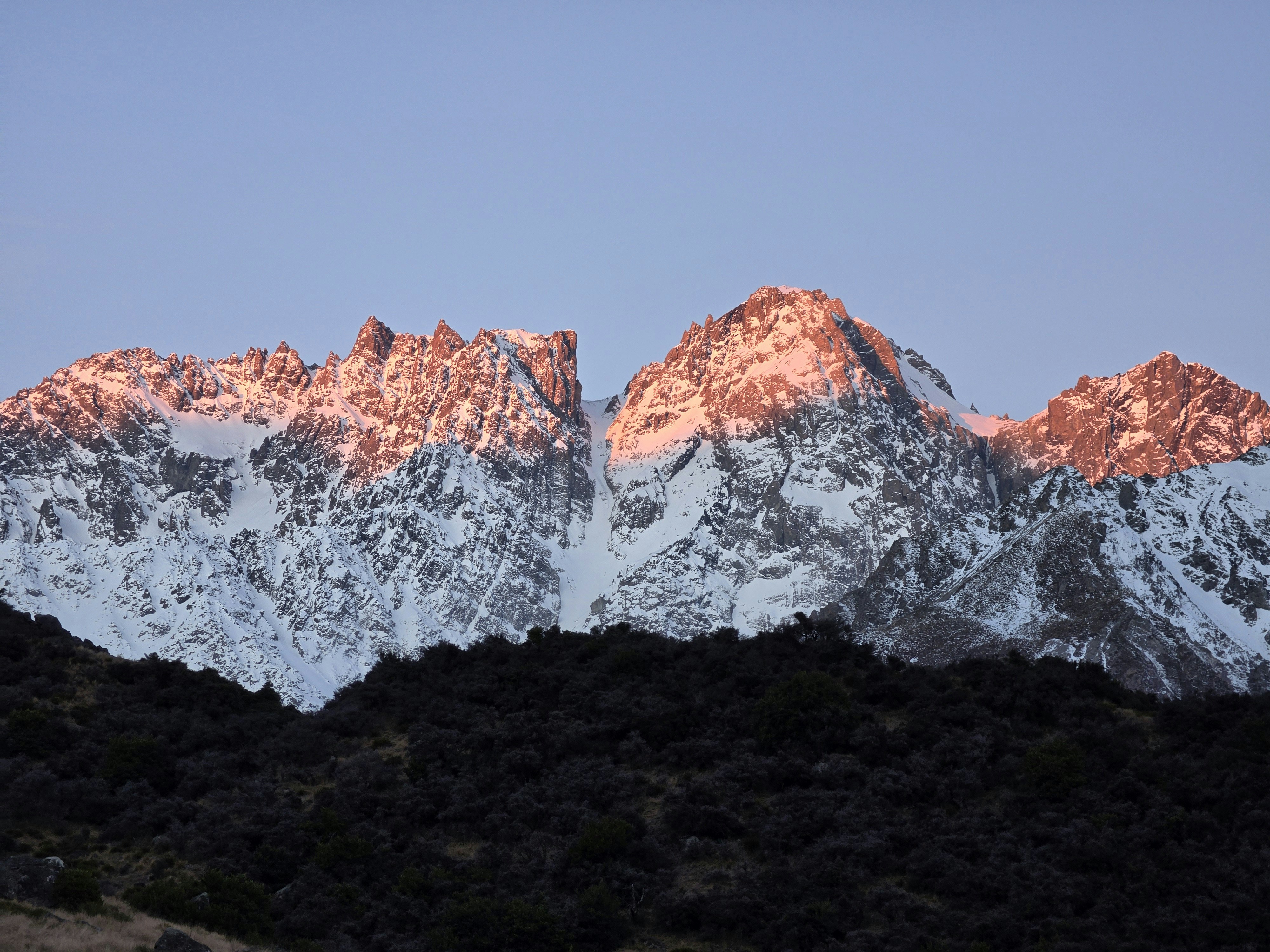 Twilight Ridge: Snowlit Peaks Against a Quiet Foothill