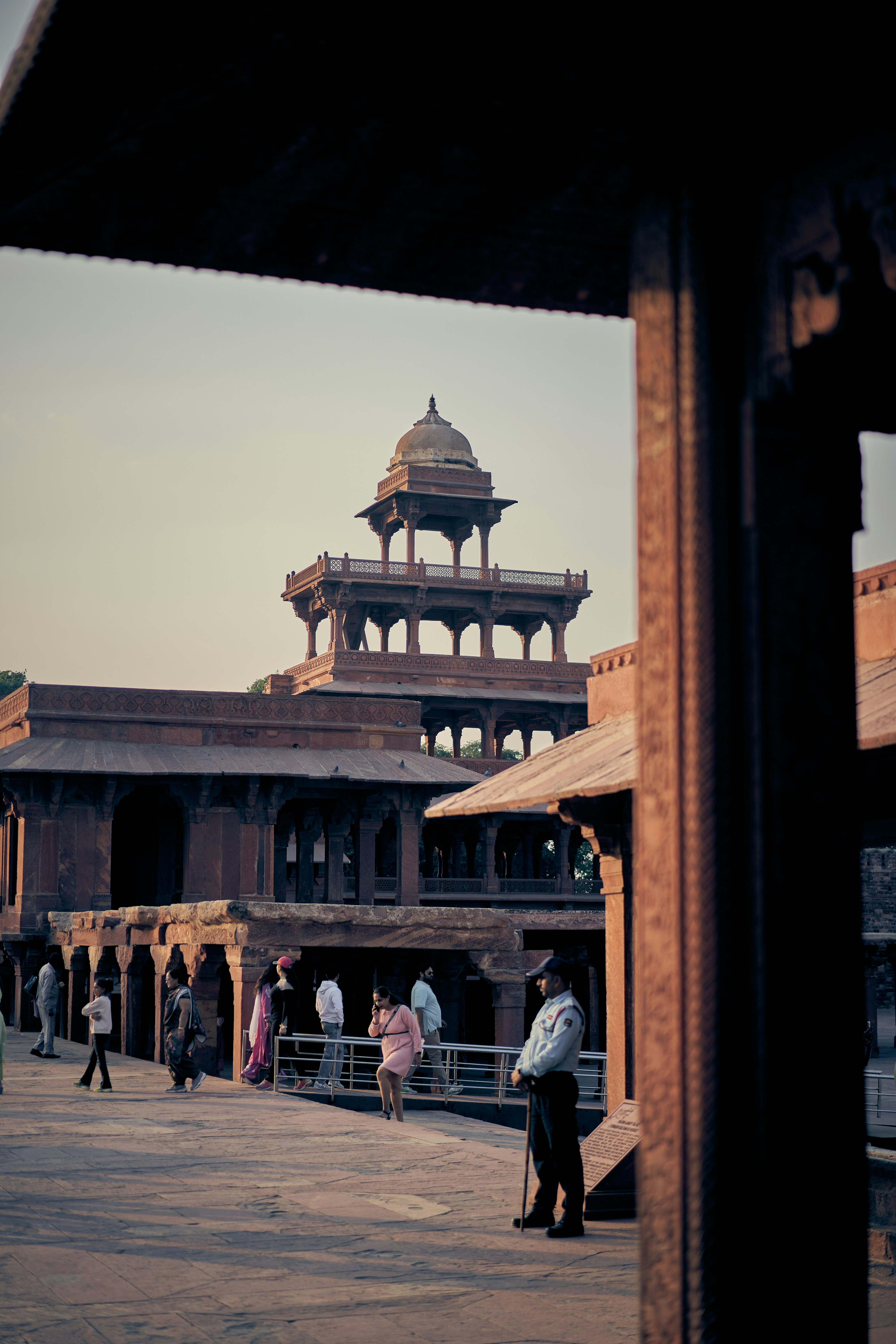 Stone Silence: A Towered Pavilion Framed by Lantern Cast Shadows