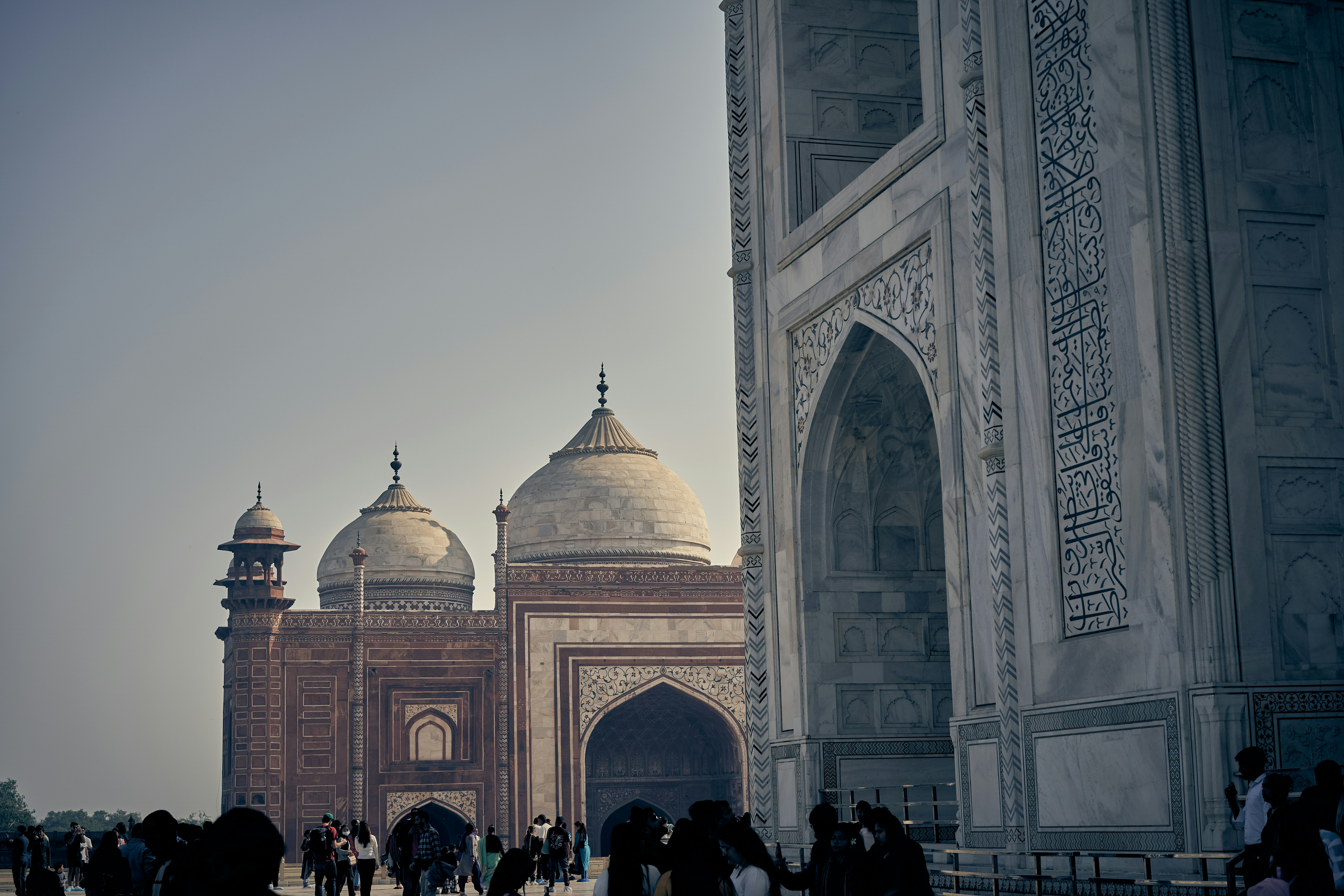 Gateway to Symmetry: People Beneath the Marble Facade of the Taj Complex