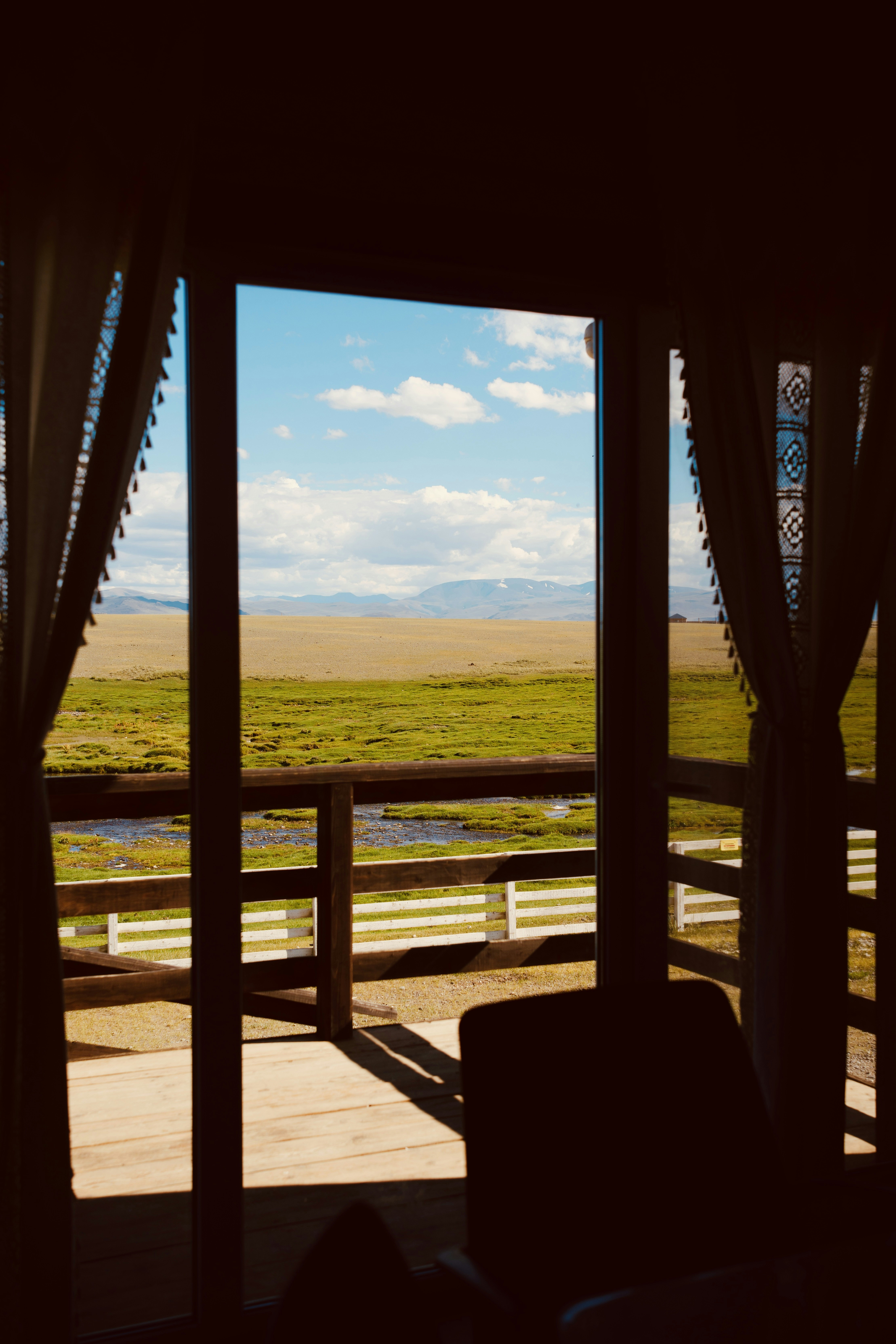 Window to the Prairie: A Quiet Interior Framing a Vast Landscape