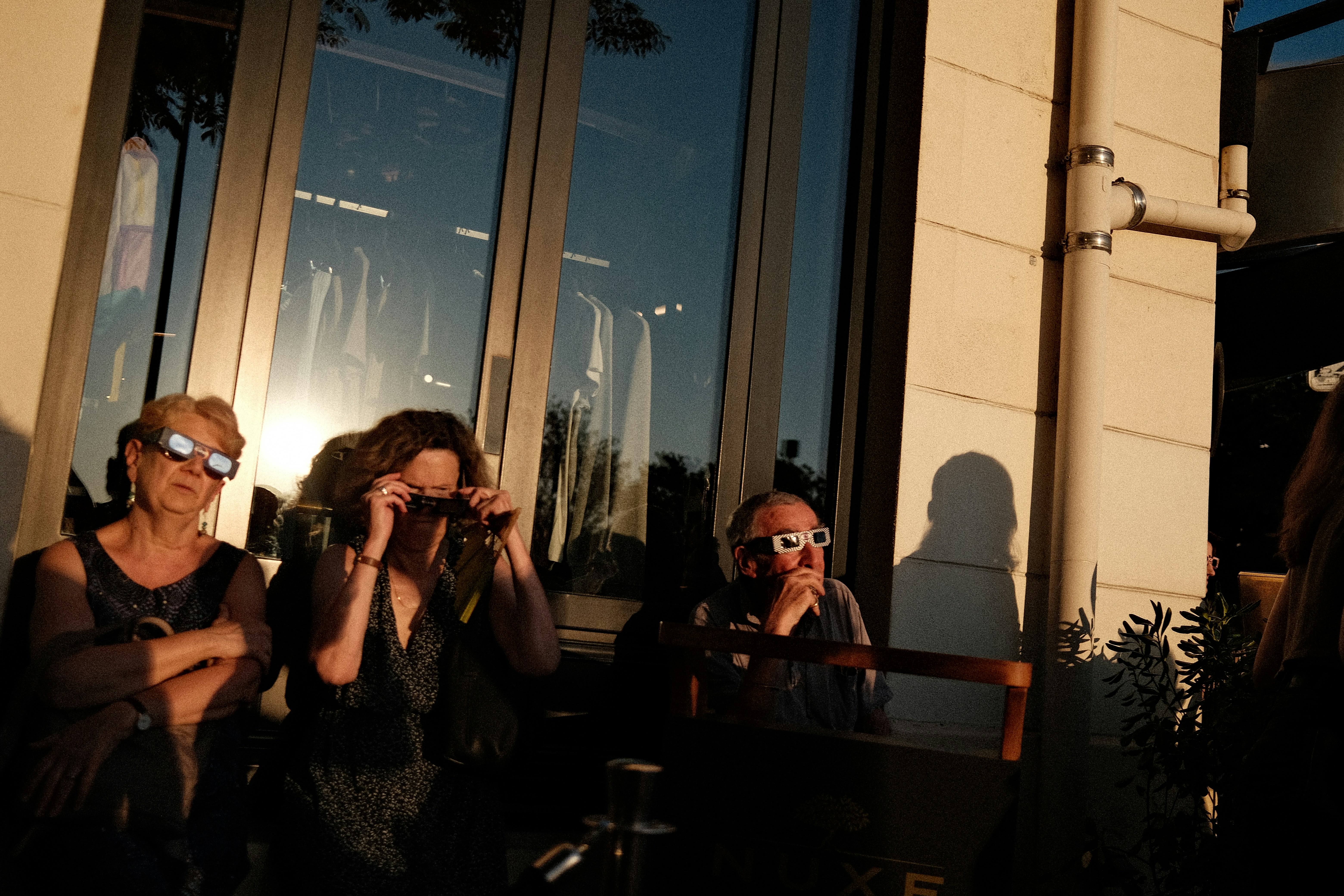 Shuttered Reflections: Portraits in the Glassy Café