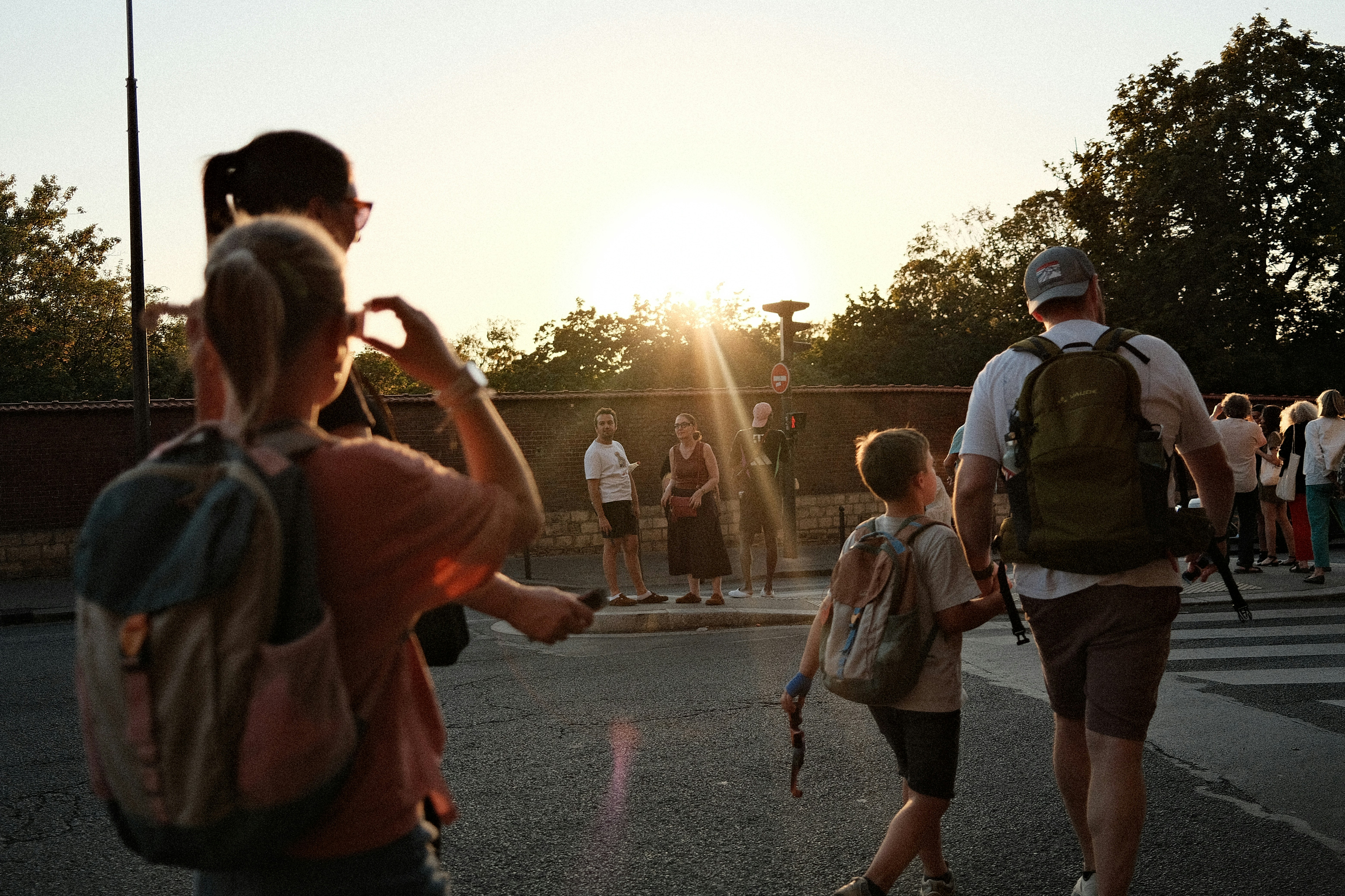 Sunset Crossing: A Bus Stop Moment on the City Walk