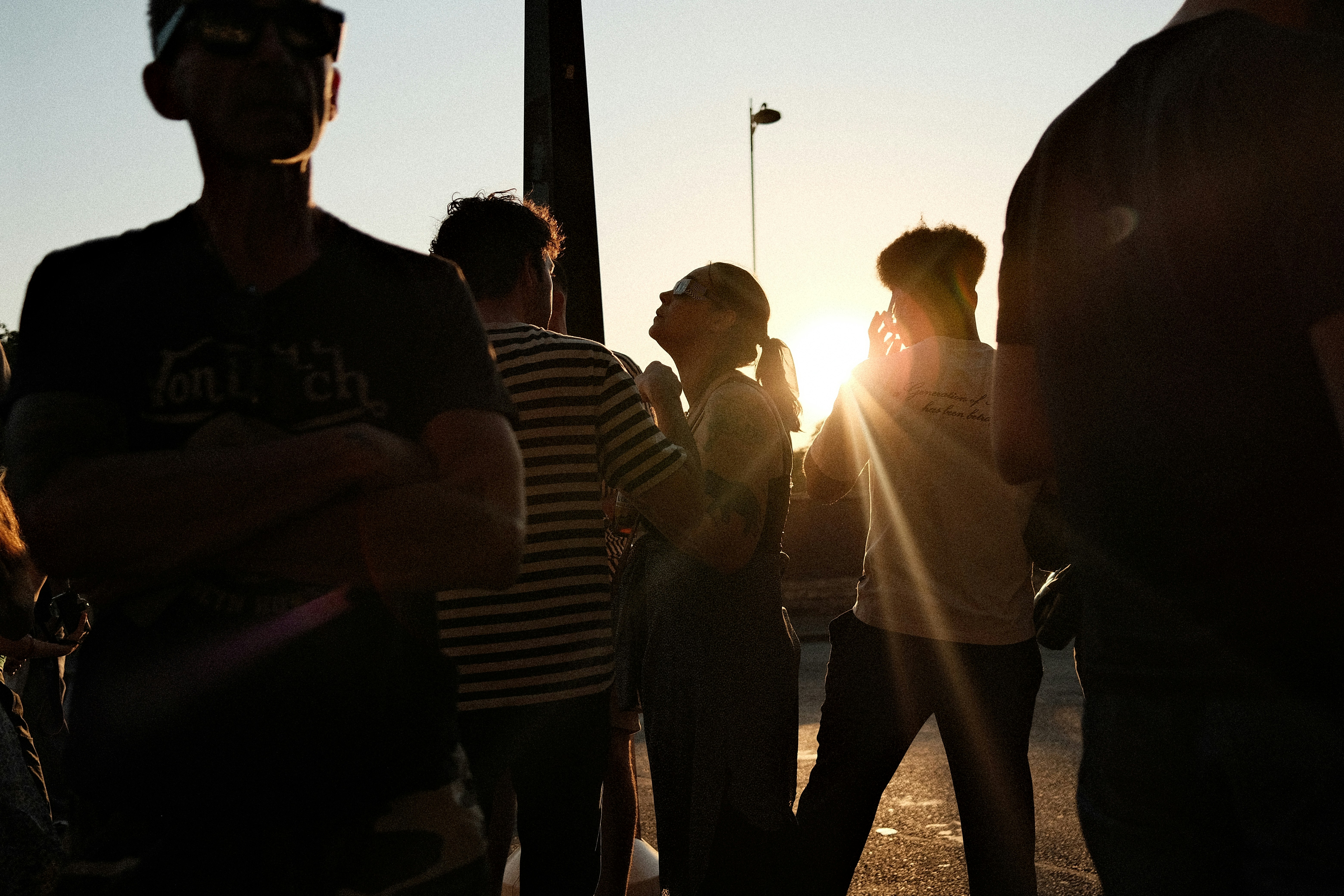 Backlit Crowd: silhouettes at the urban sunset
