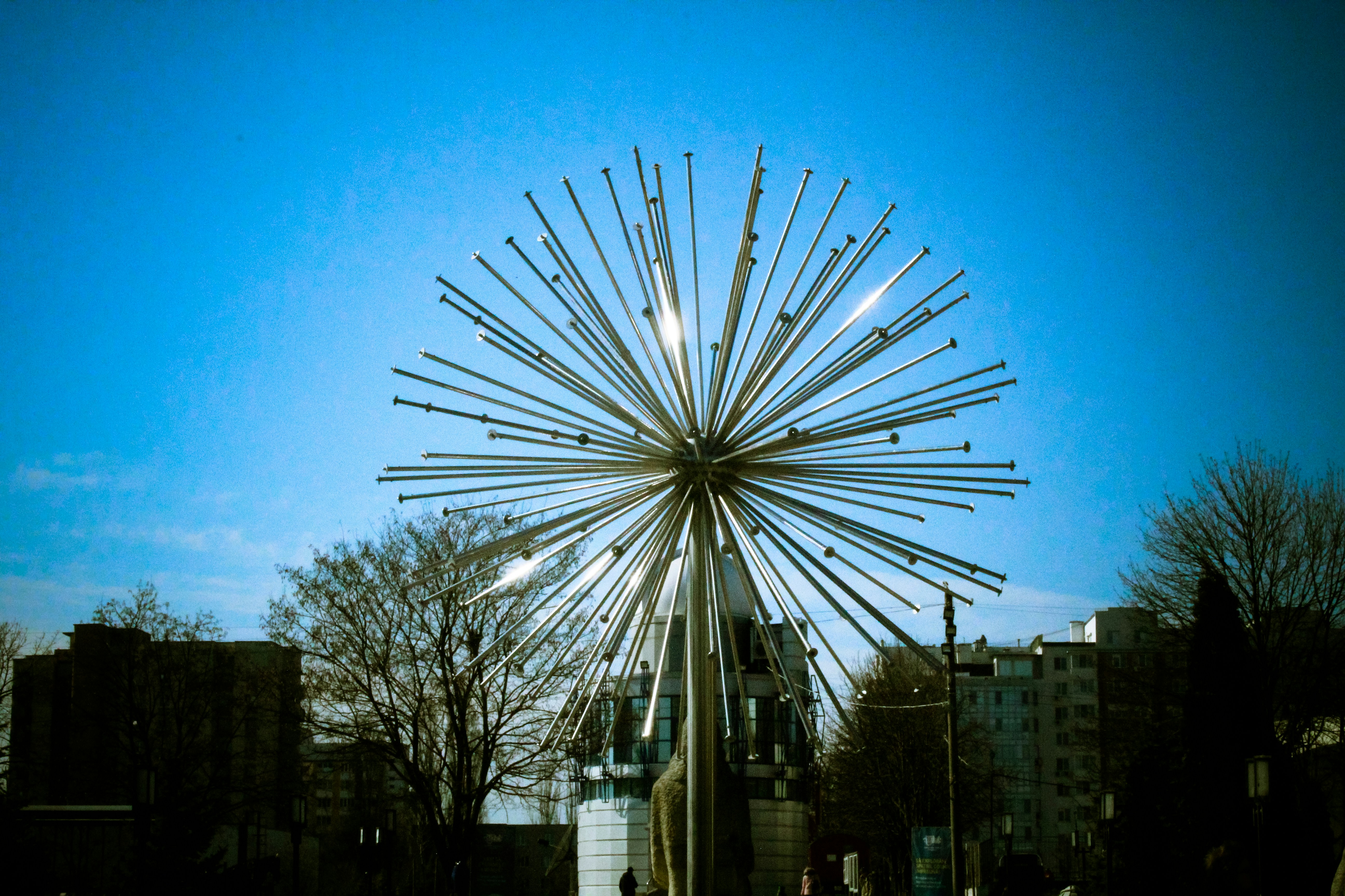 Urban Starburst: The Spiked Monument Against a Clear Day
