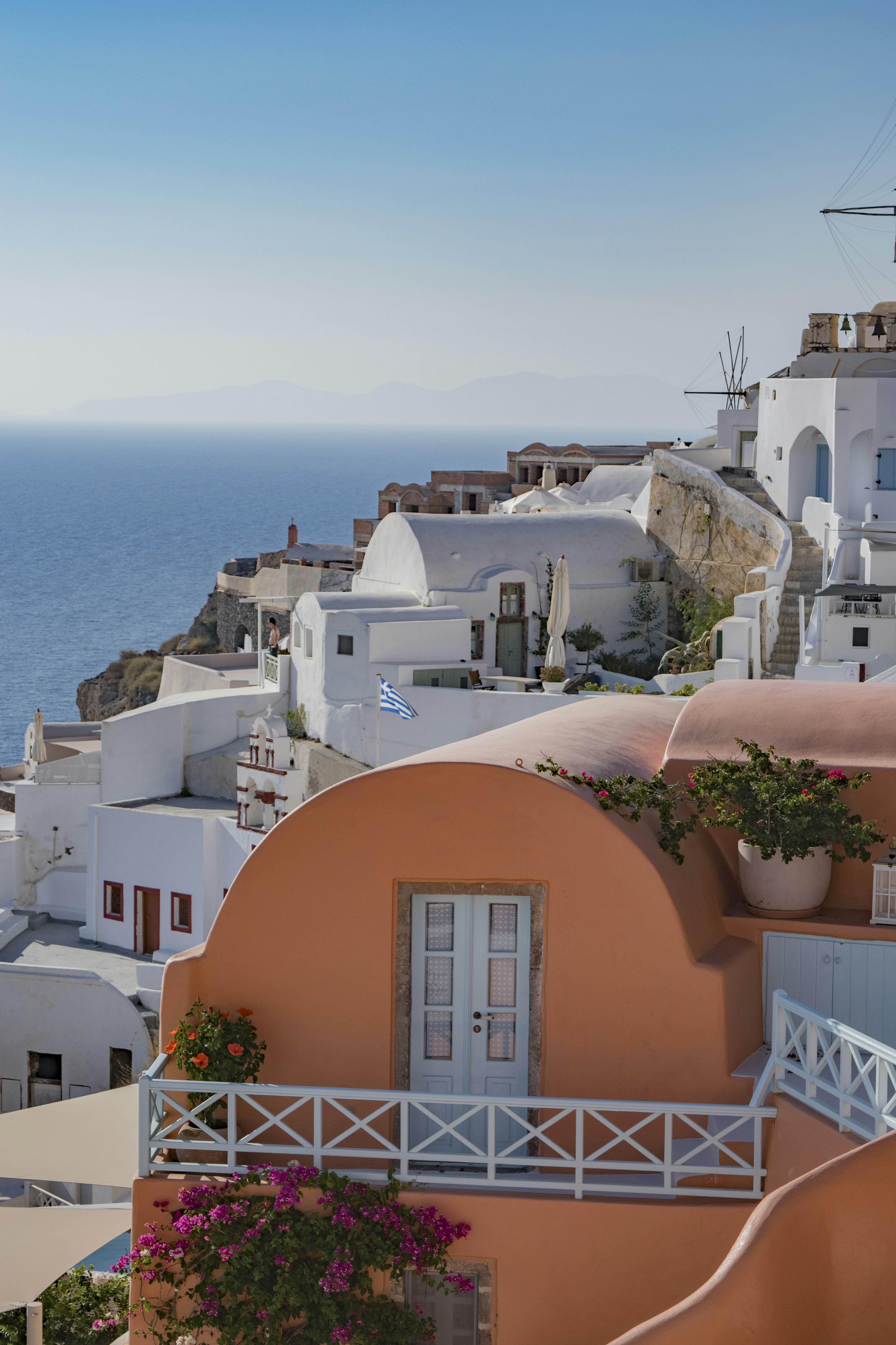 Terracotta Dunes: A Cliffside Village Overlooking Aegean Blues