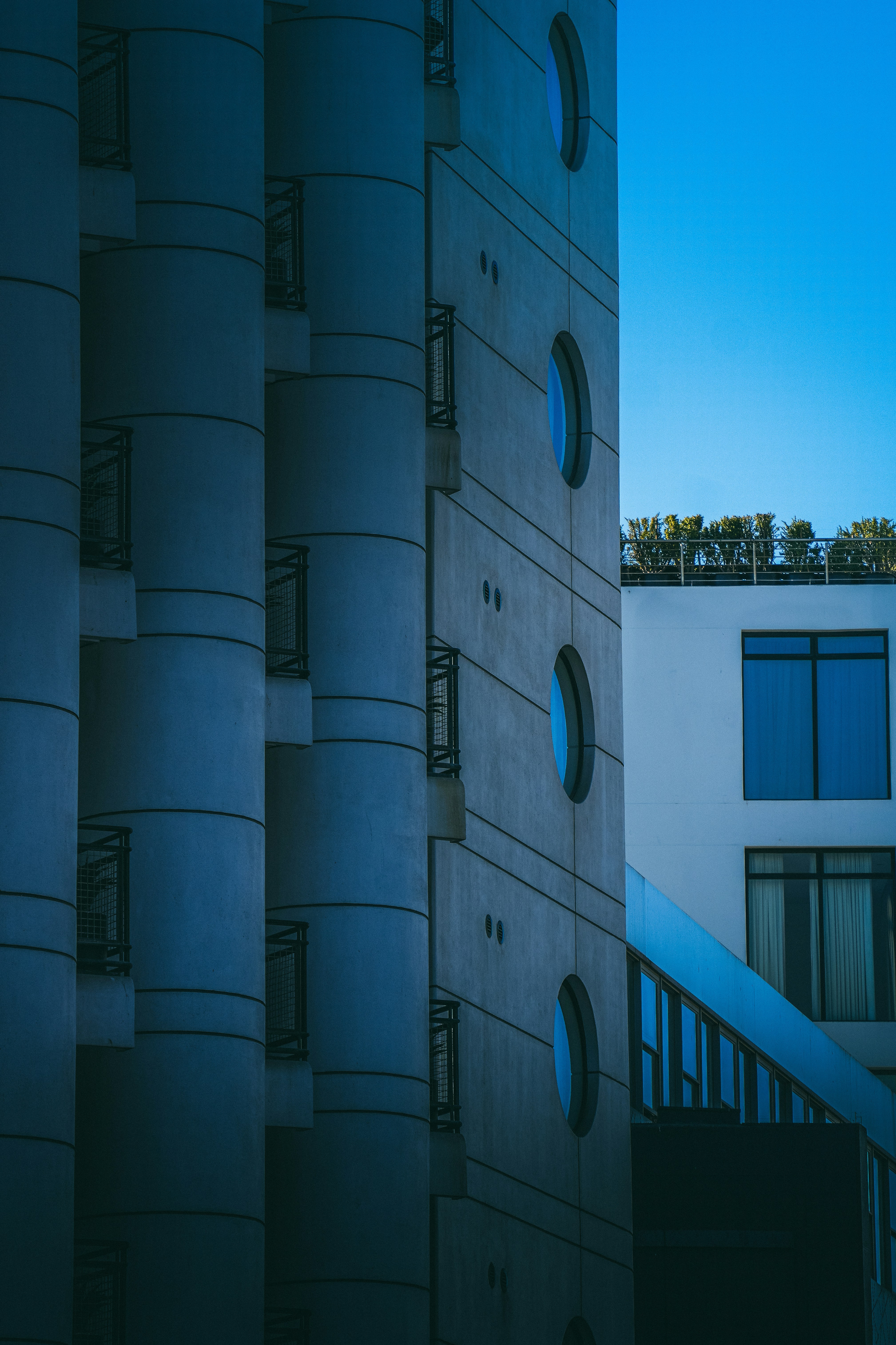 Blue-toned architecture: stacked columns and a modern façade