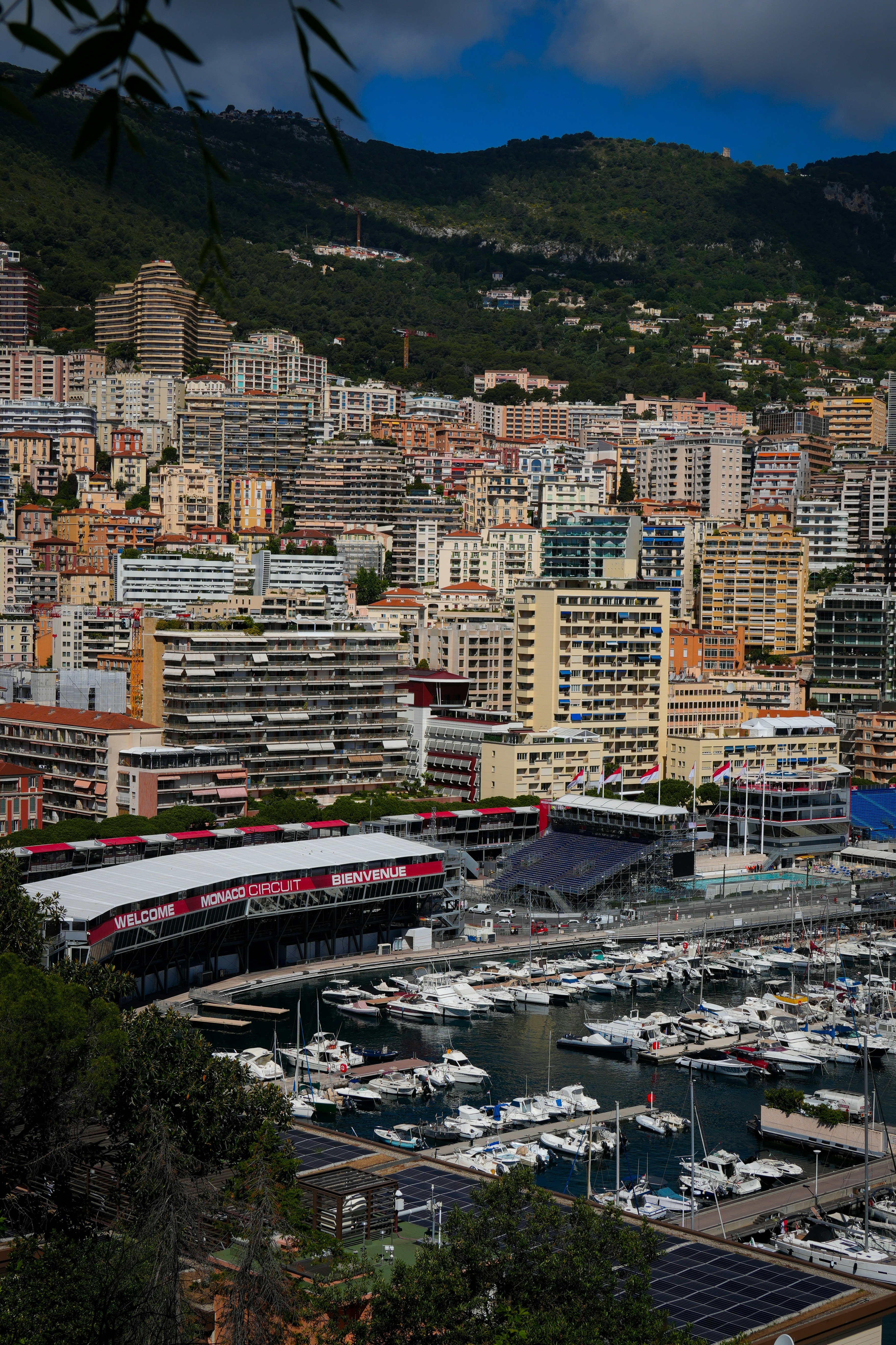 Harborfront towers tucked into a hillside cityscape