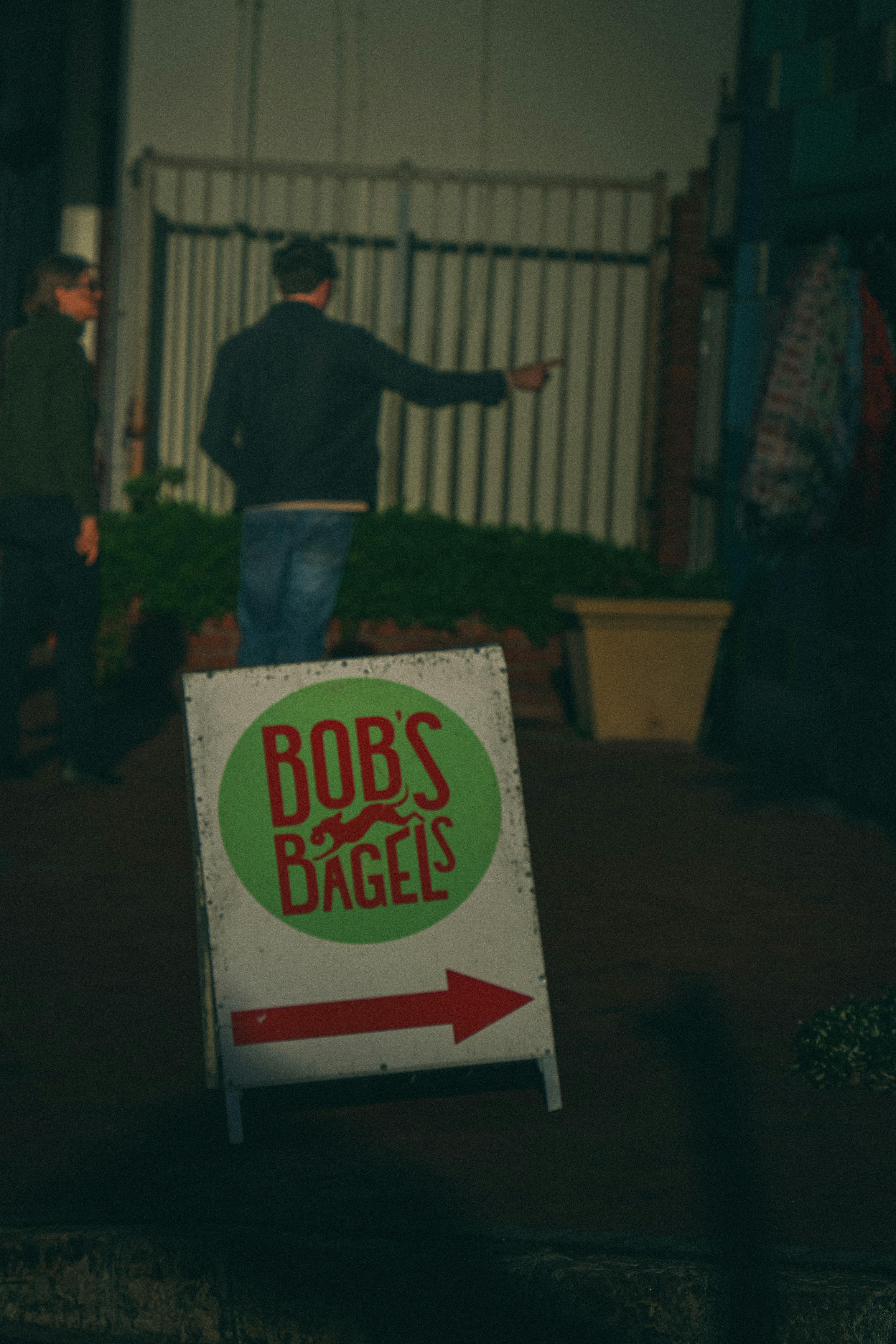 Signpost to Bob’s Bagels: A Quiet Street Scene in Twilight