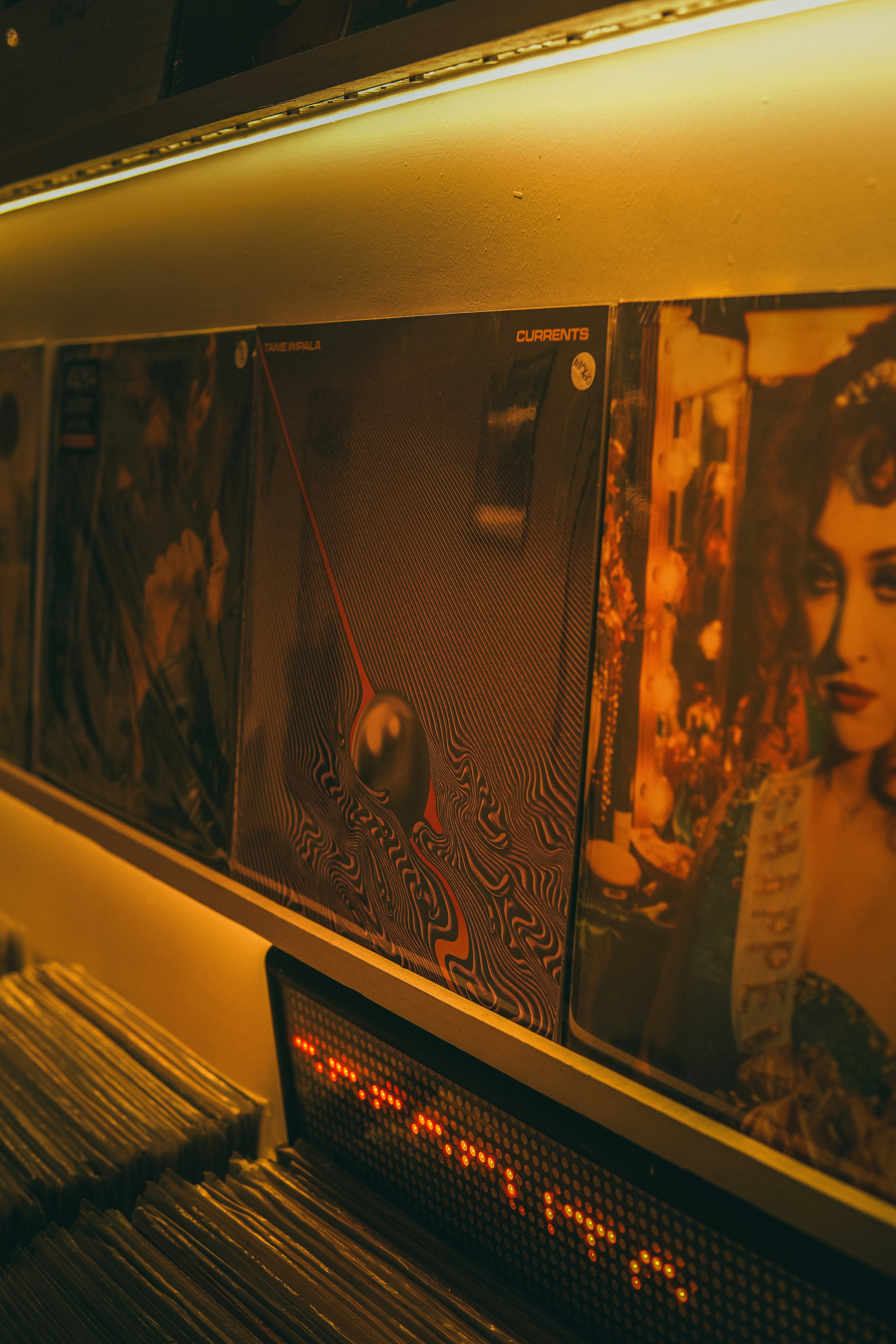 Analog Echoes: Vinyl Shelves Beneath Warm Neon