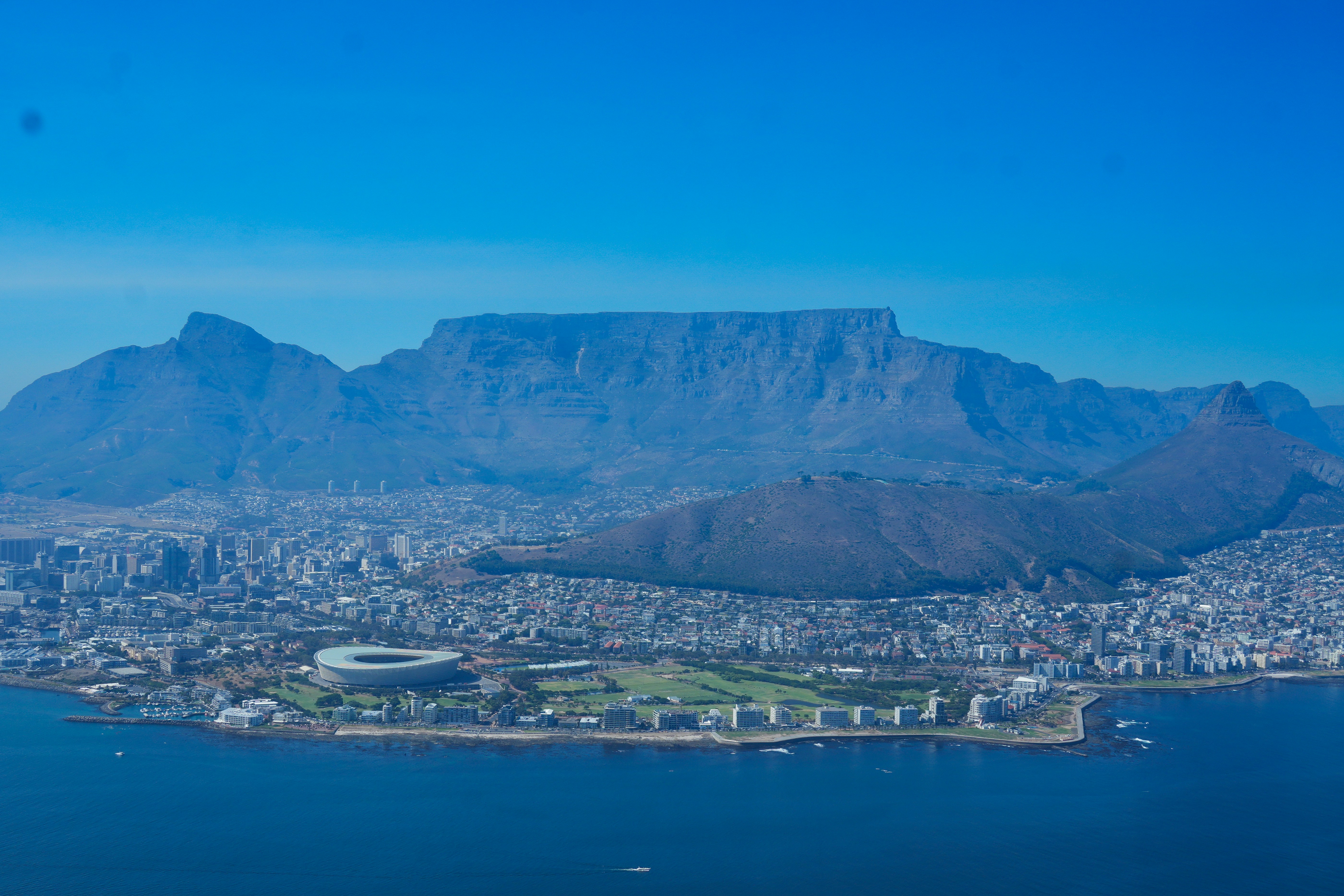 Table Mountain silhouette over a harbor city