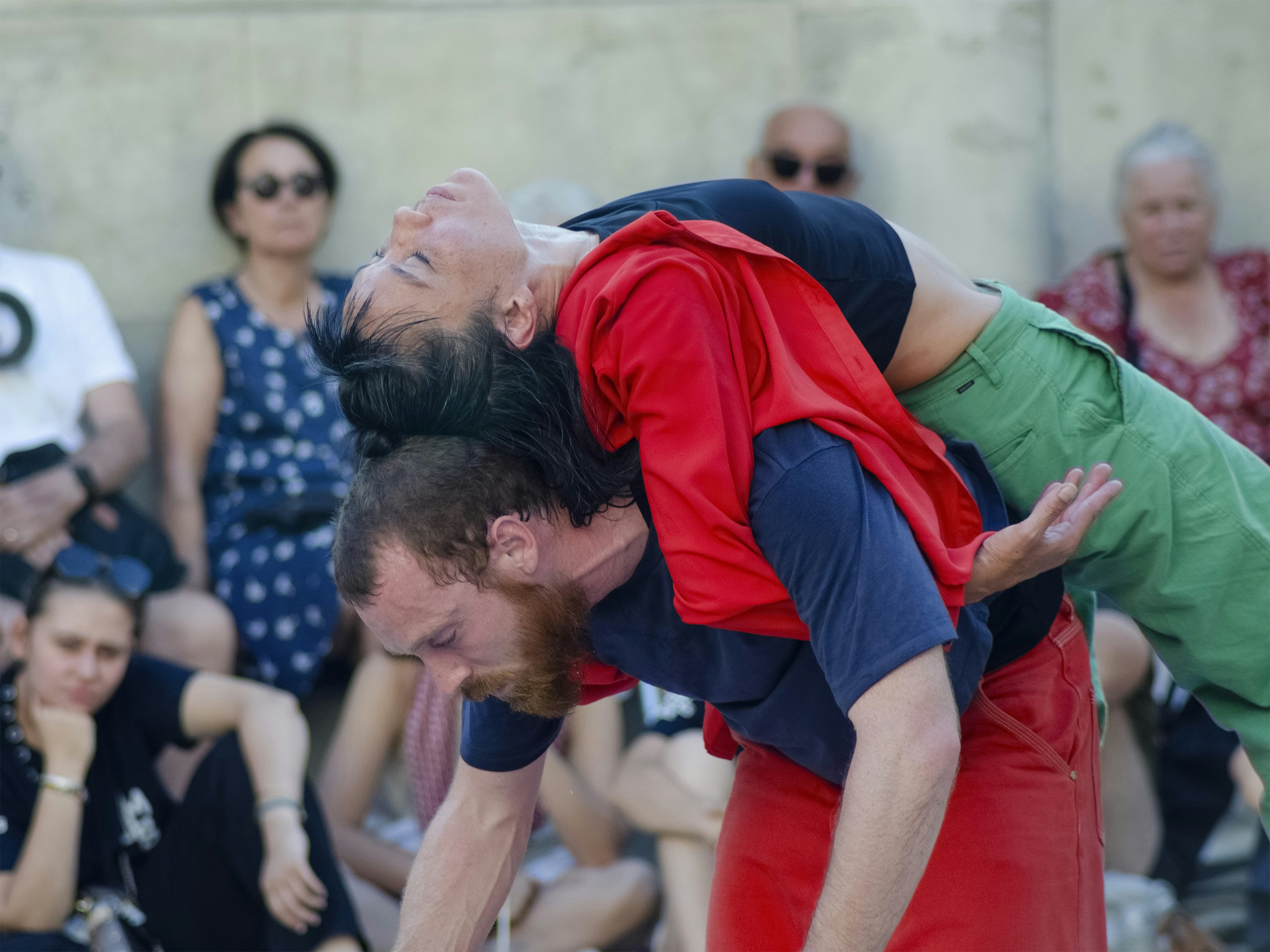 Tangled Grace: A Duo in Motion During a Street Performance