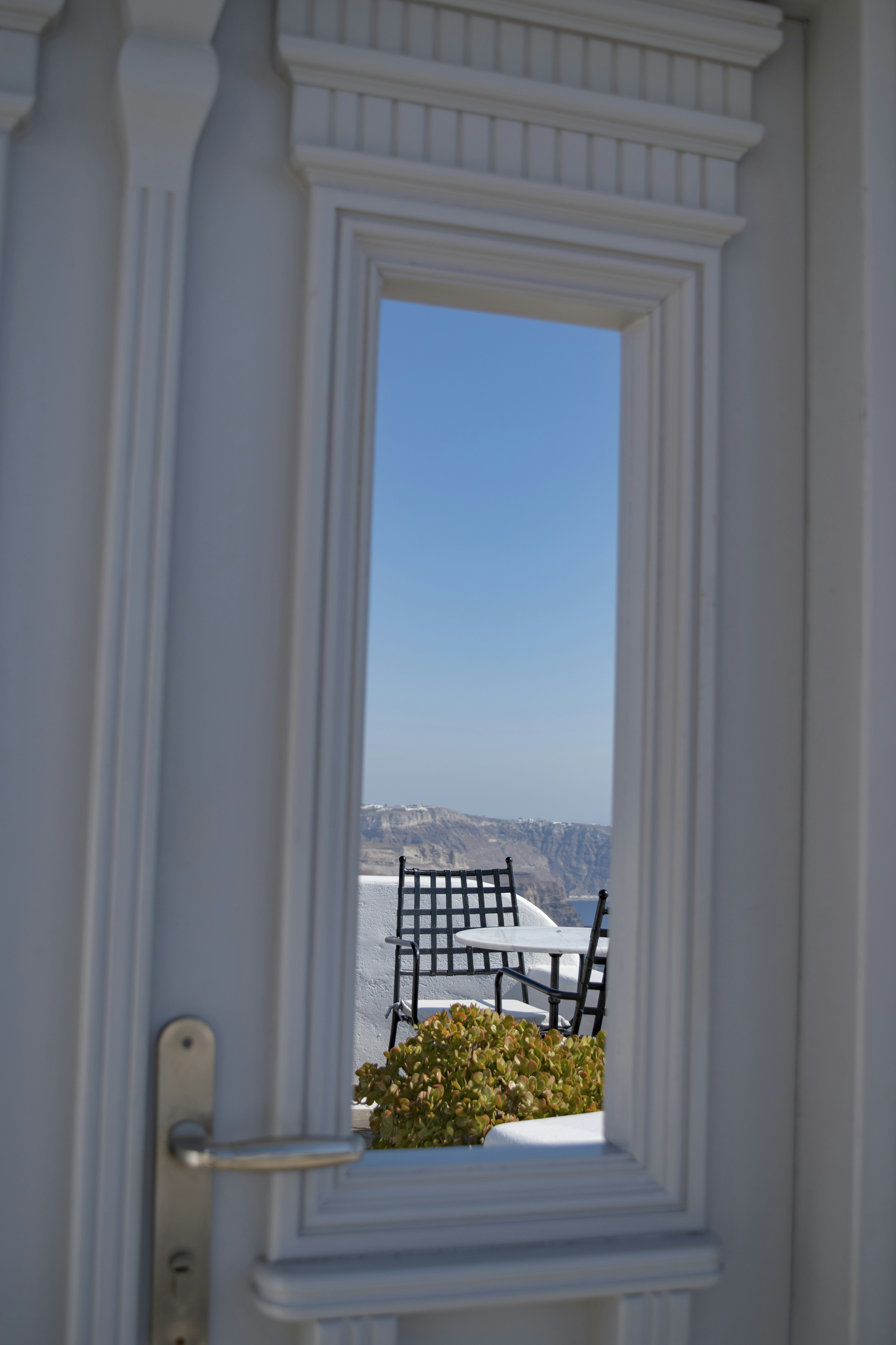 A Quiet View Through a Framed Terrace Door