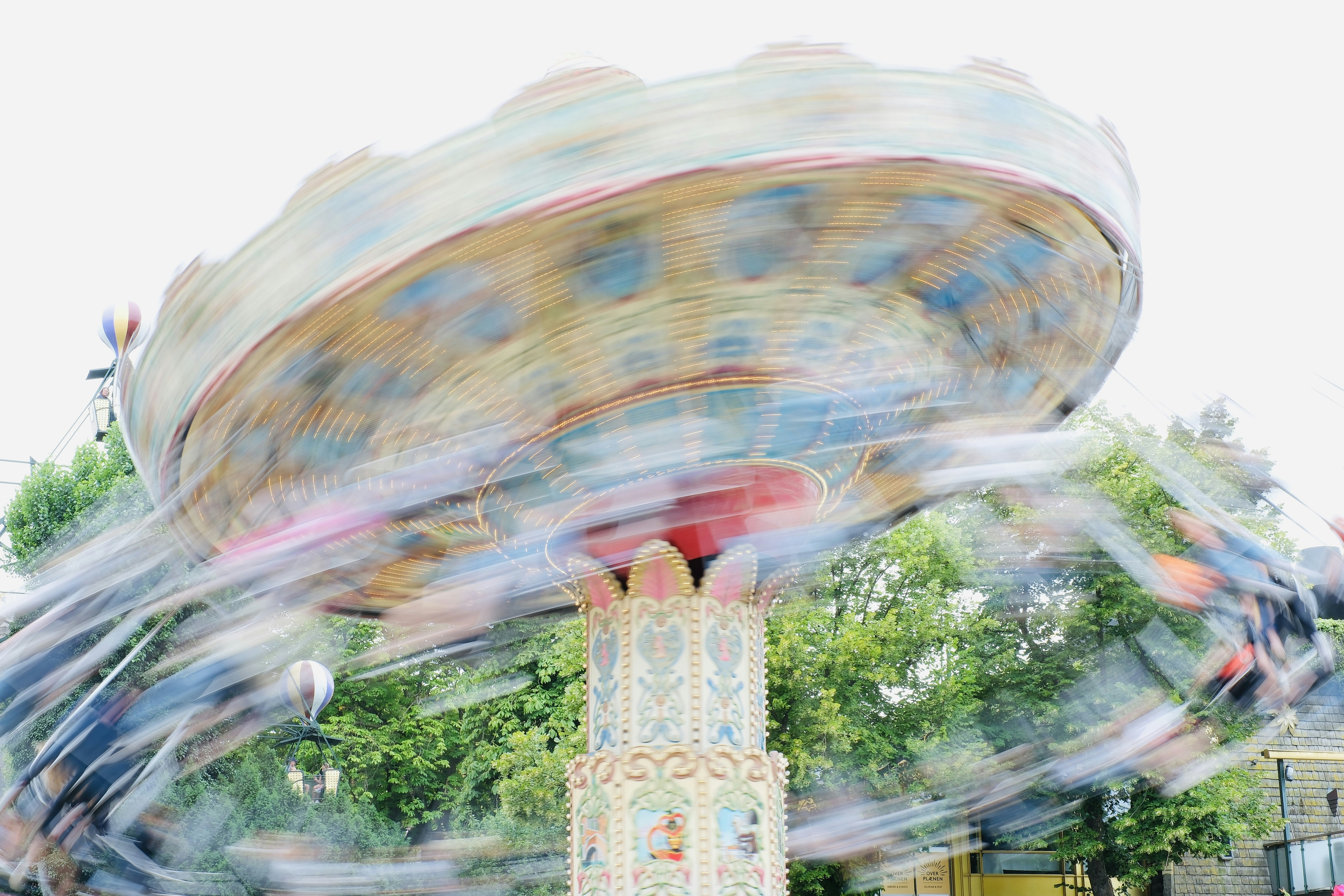 Blurred Carousel Spin: Whirl of Color and Motion