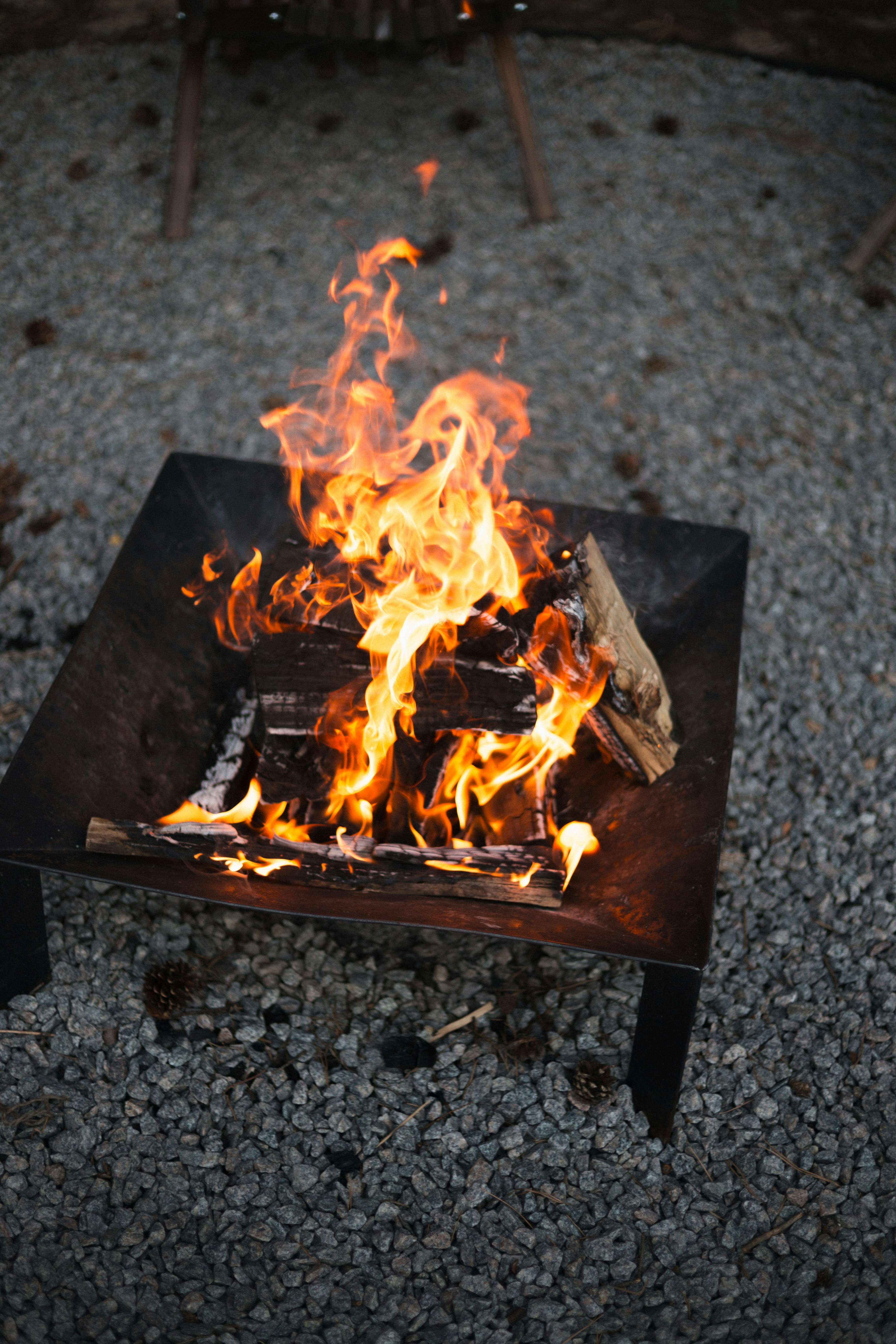 Firelight on a Gravel Stage: A Quiet Outdoor Ember Portrait