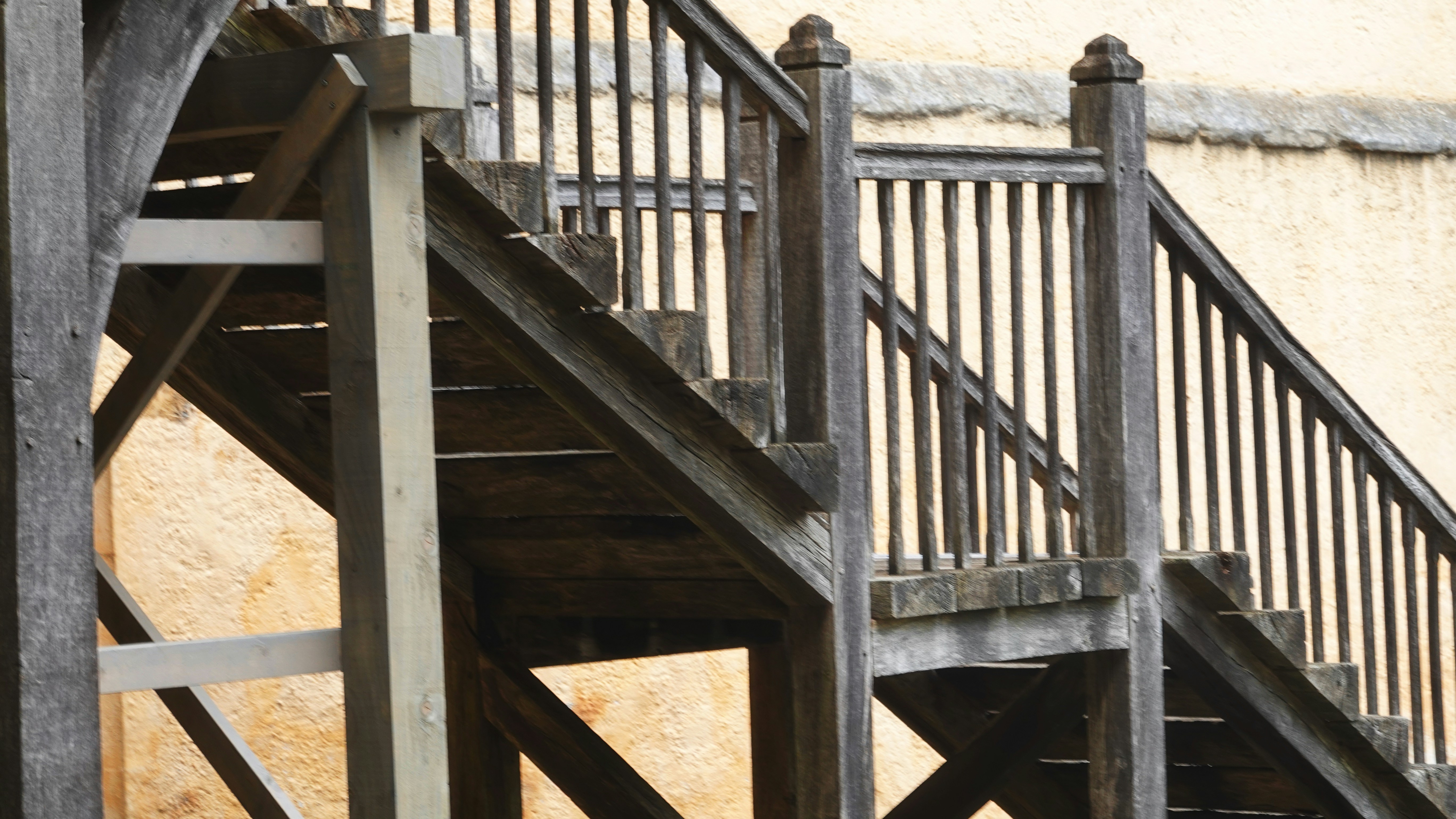 Weathered Staircase: Interplay of Light and Shadow on Timber
