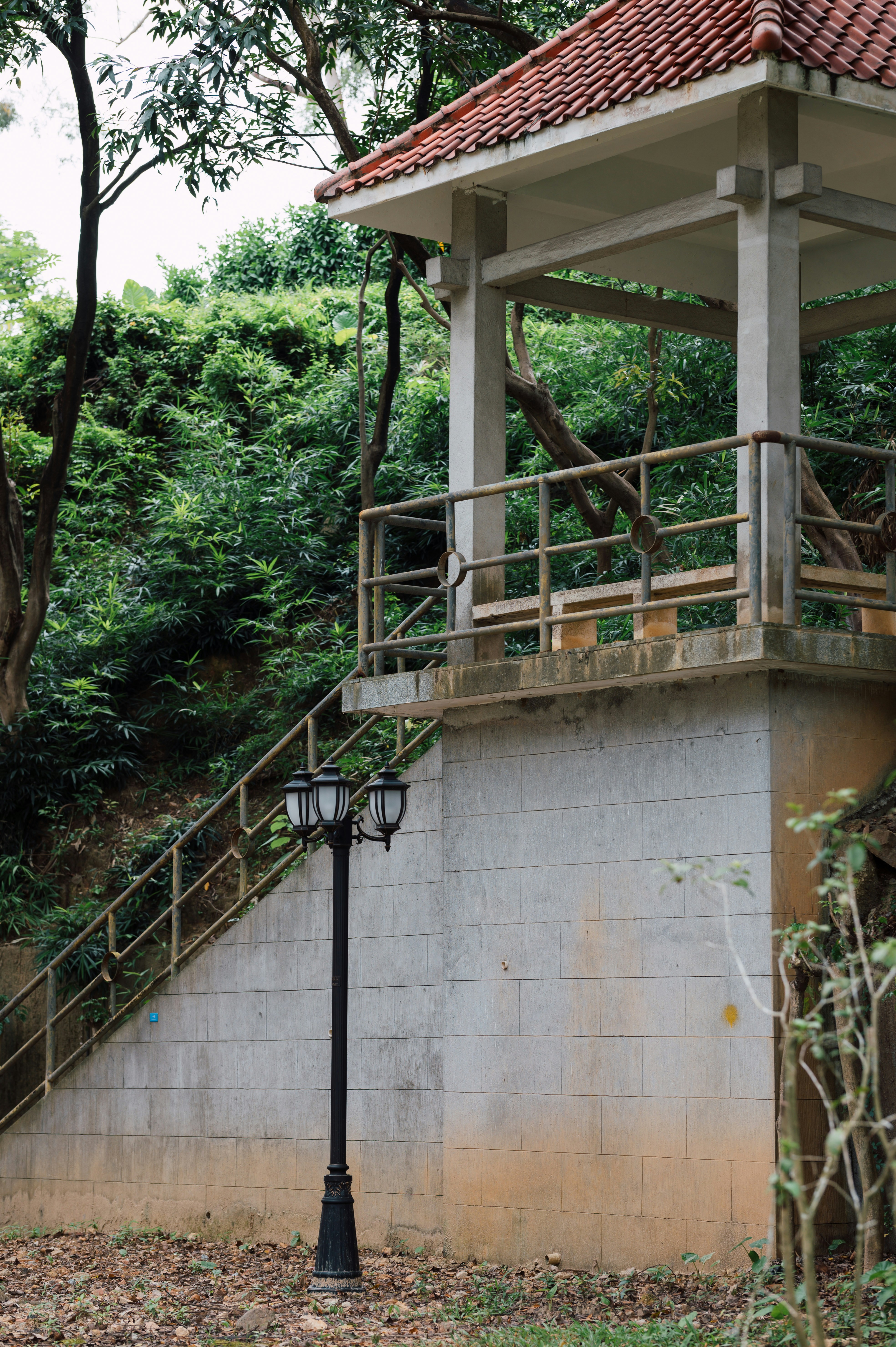Rusted Lanterns Beneath the Garden Pavilion