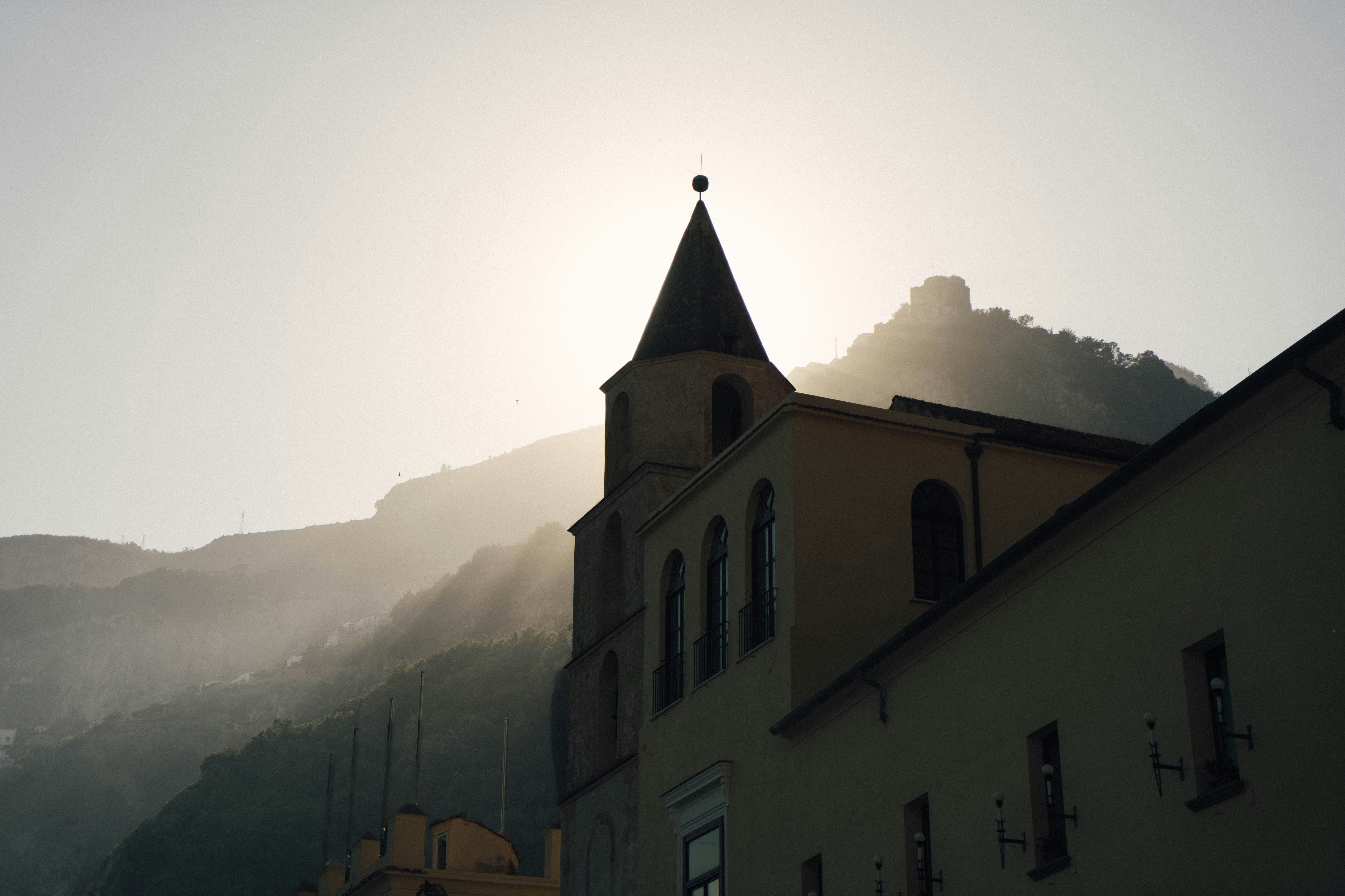 Sunlit Steeple Looms Over Quiet Village