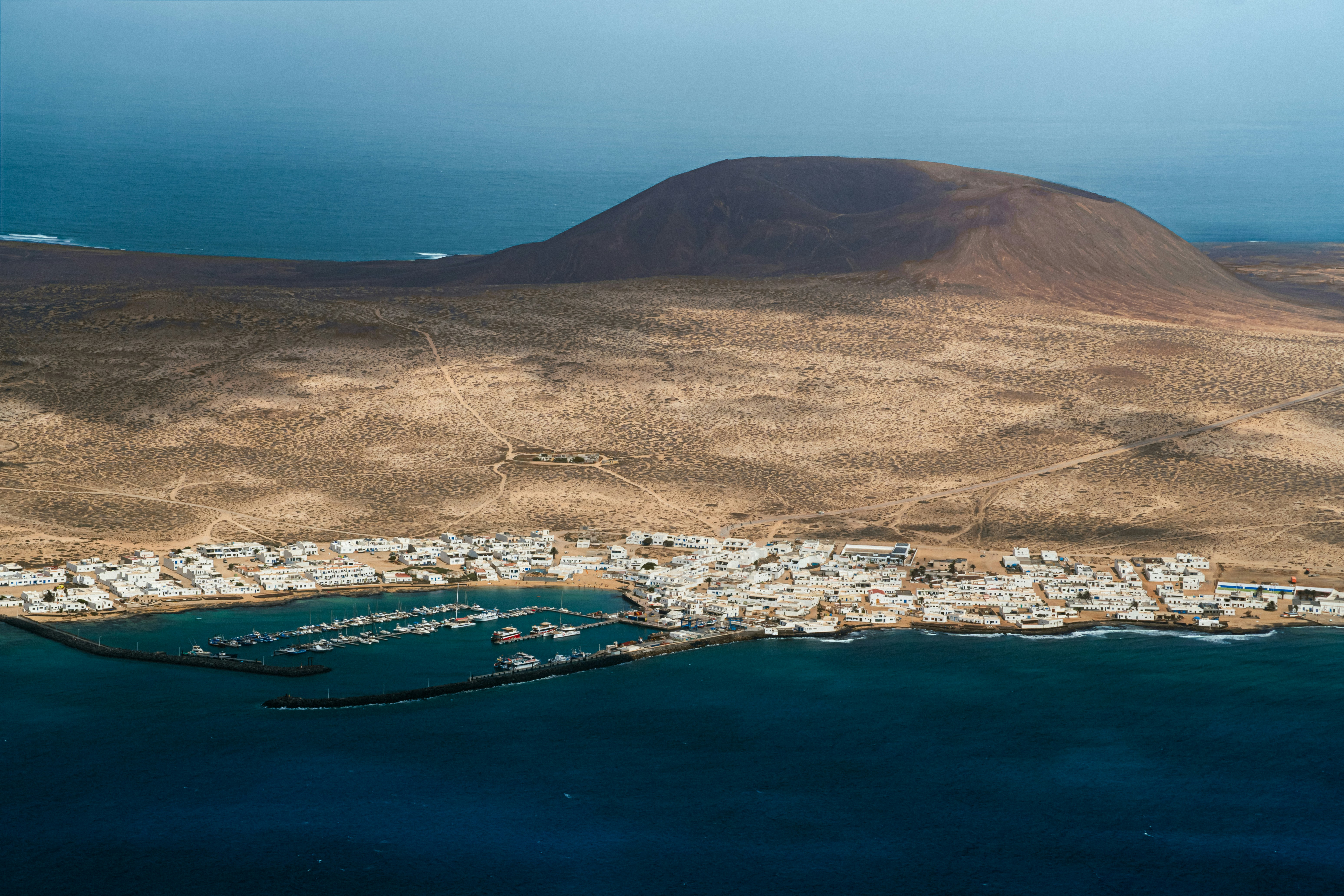 Harbor Fingers Quietly Embrace a Deserted Volcanic Edge
