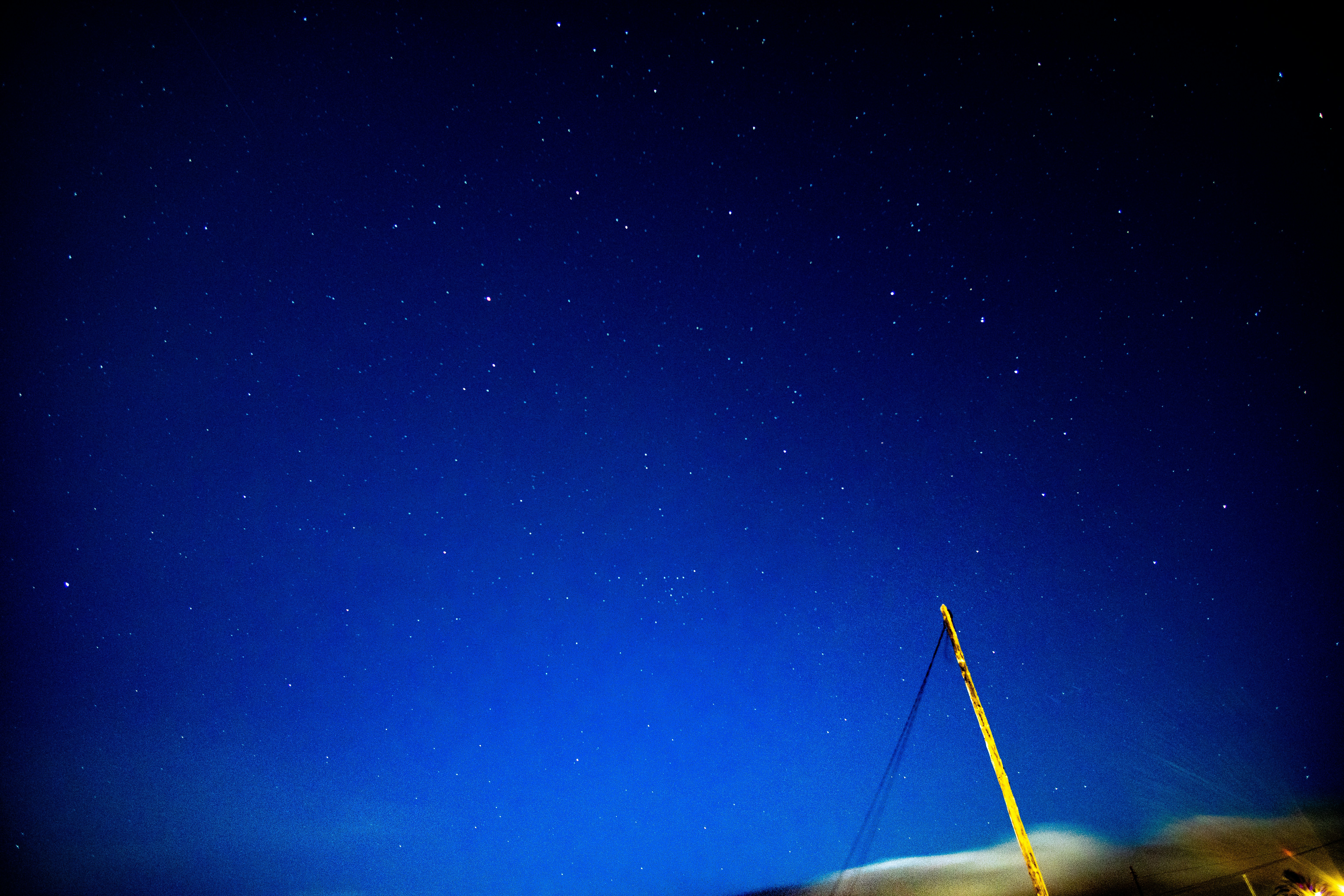 Pole Beneath a Starry Sheath: Nightscape with Skyward Antenna