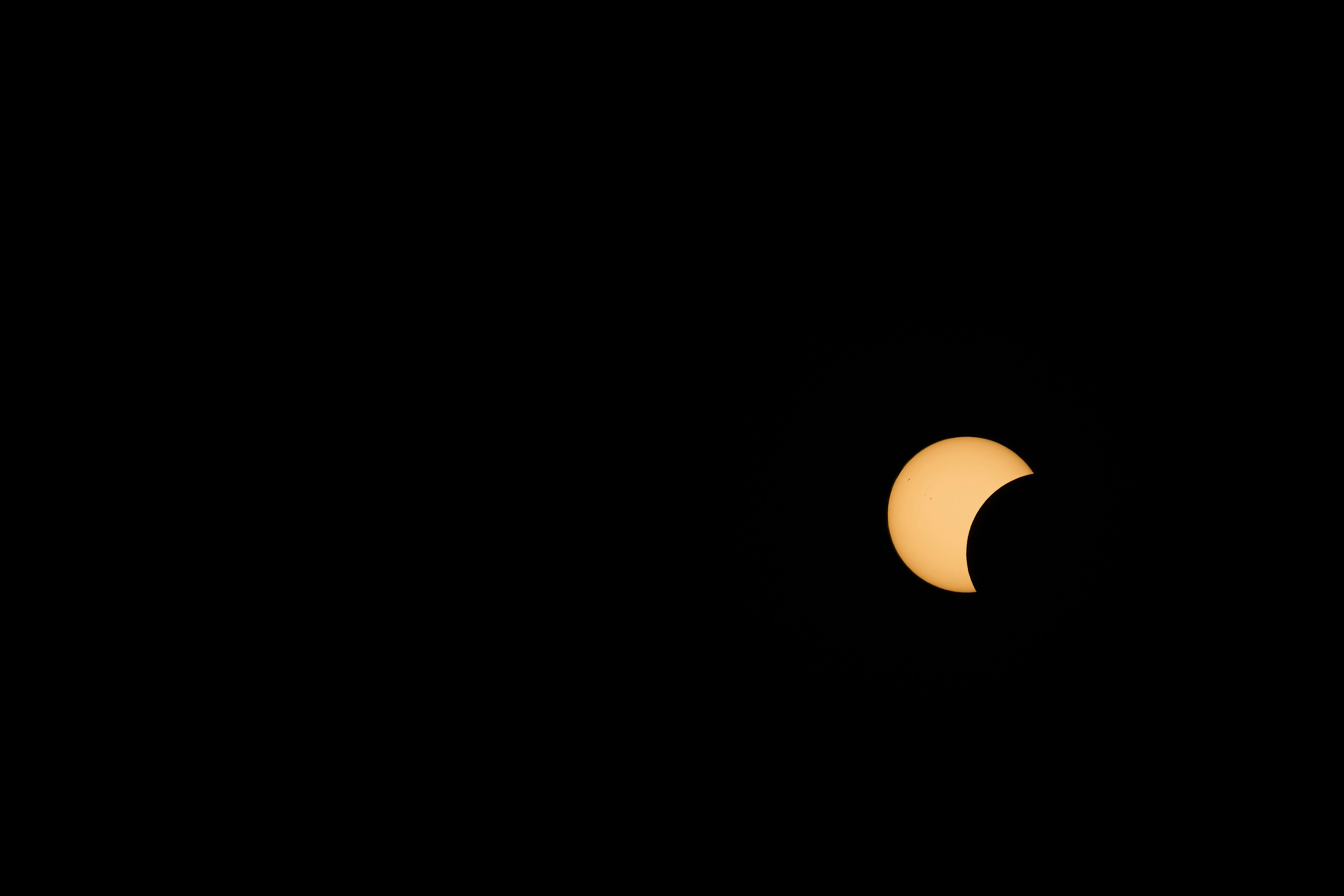 Partial Eclipse: A Sliver of Moon Emerges in the Night