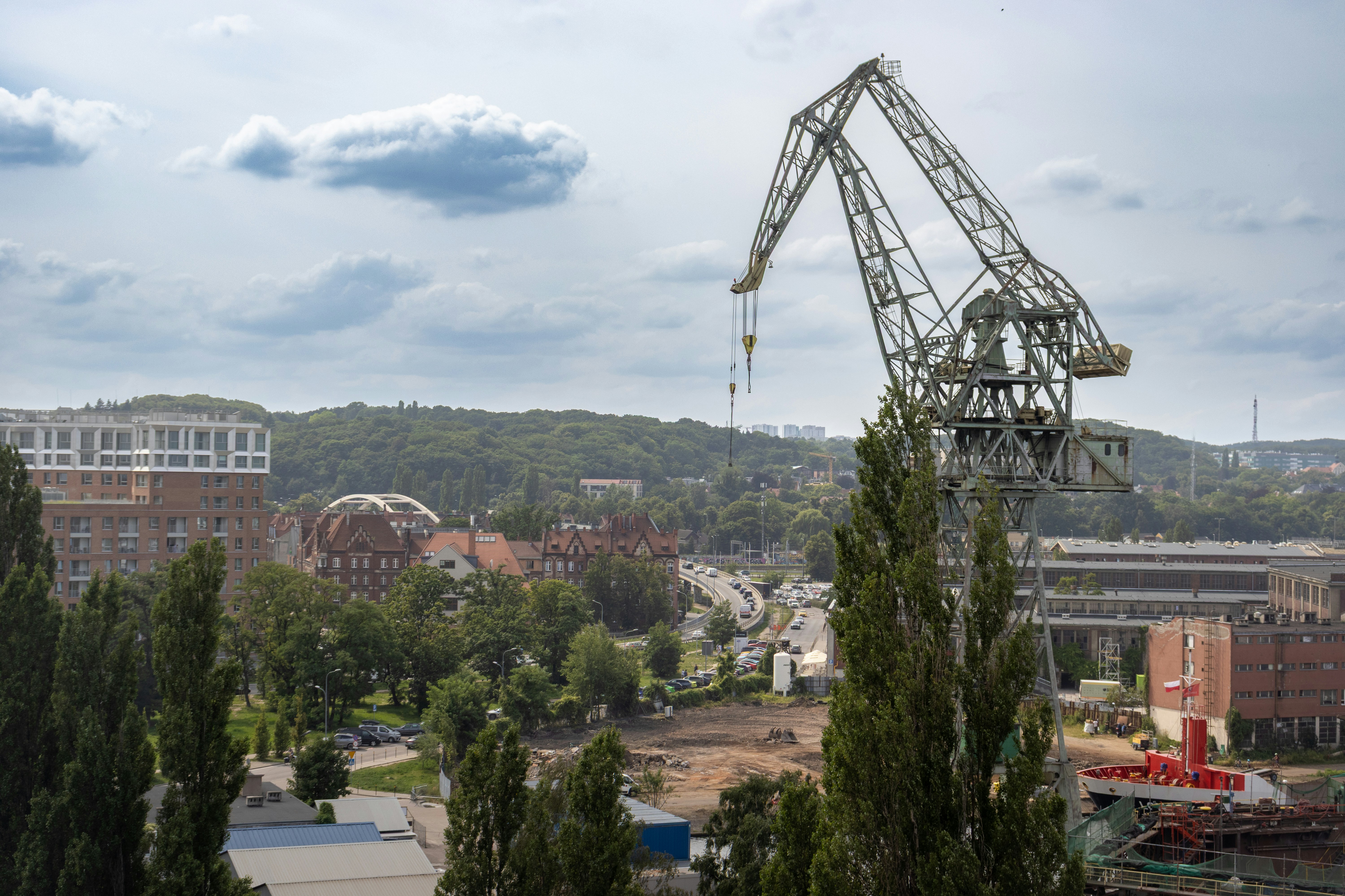 Crane Over the City: A Glimpse of Industry and Horizon