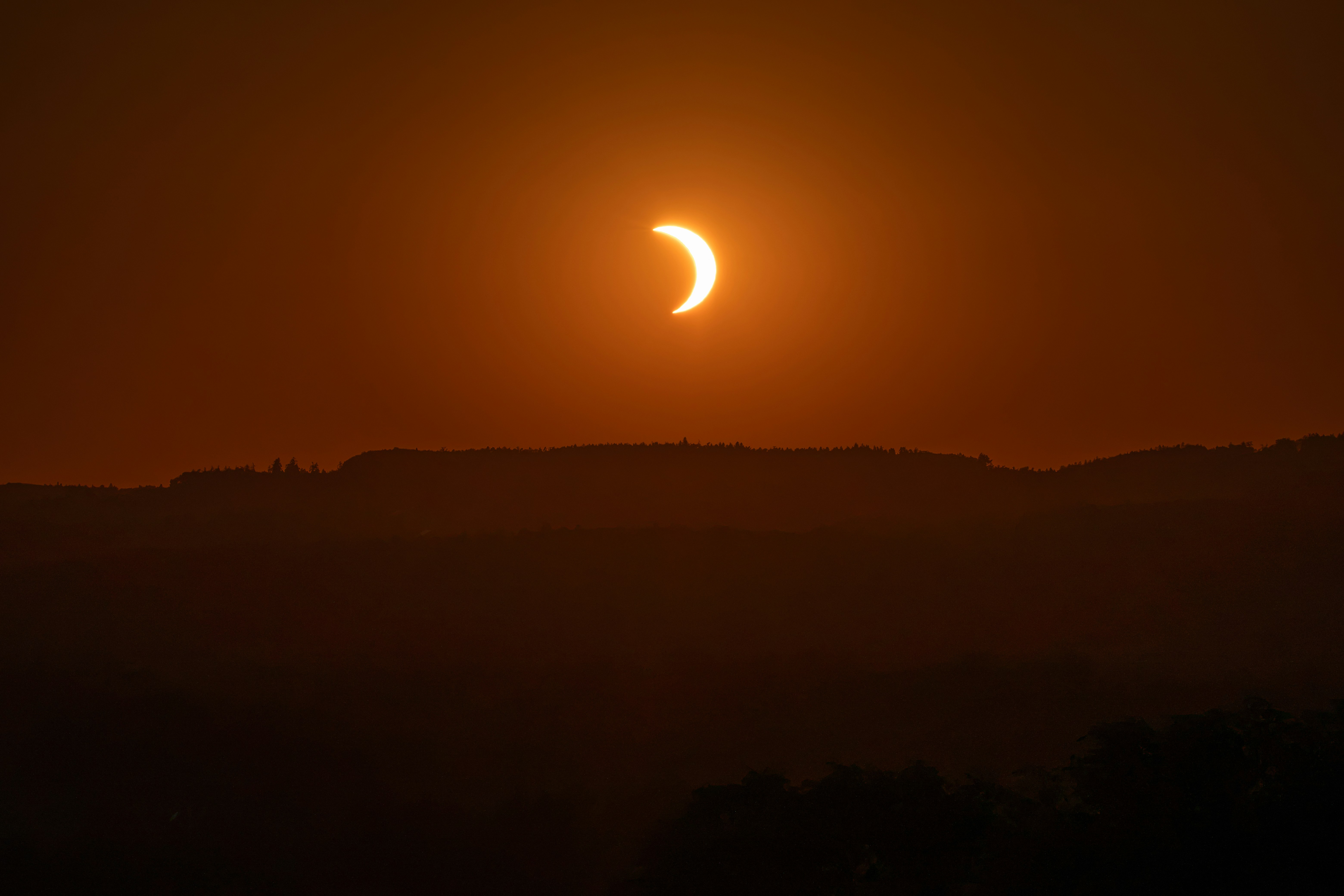 Crescent Dawn Over Quiet Hills