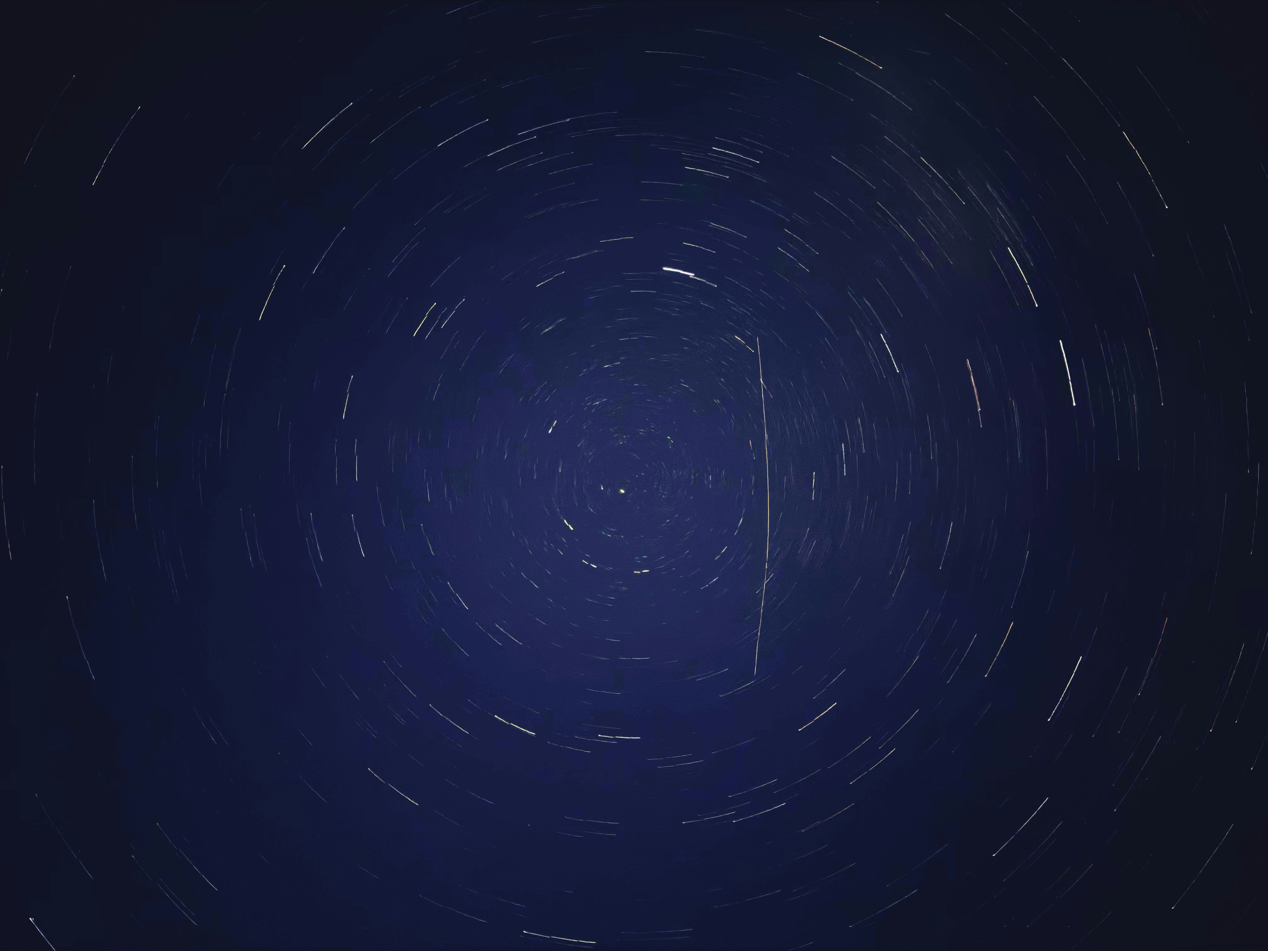 Circular Nightscape: Star Trails Centered in Quiet Darkness