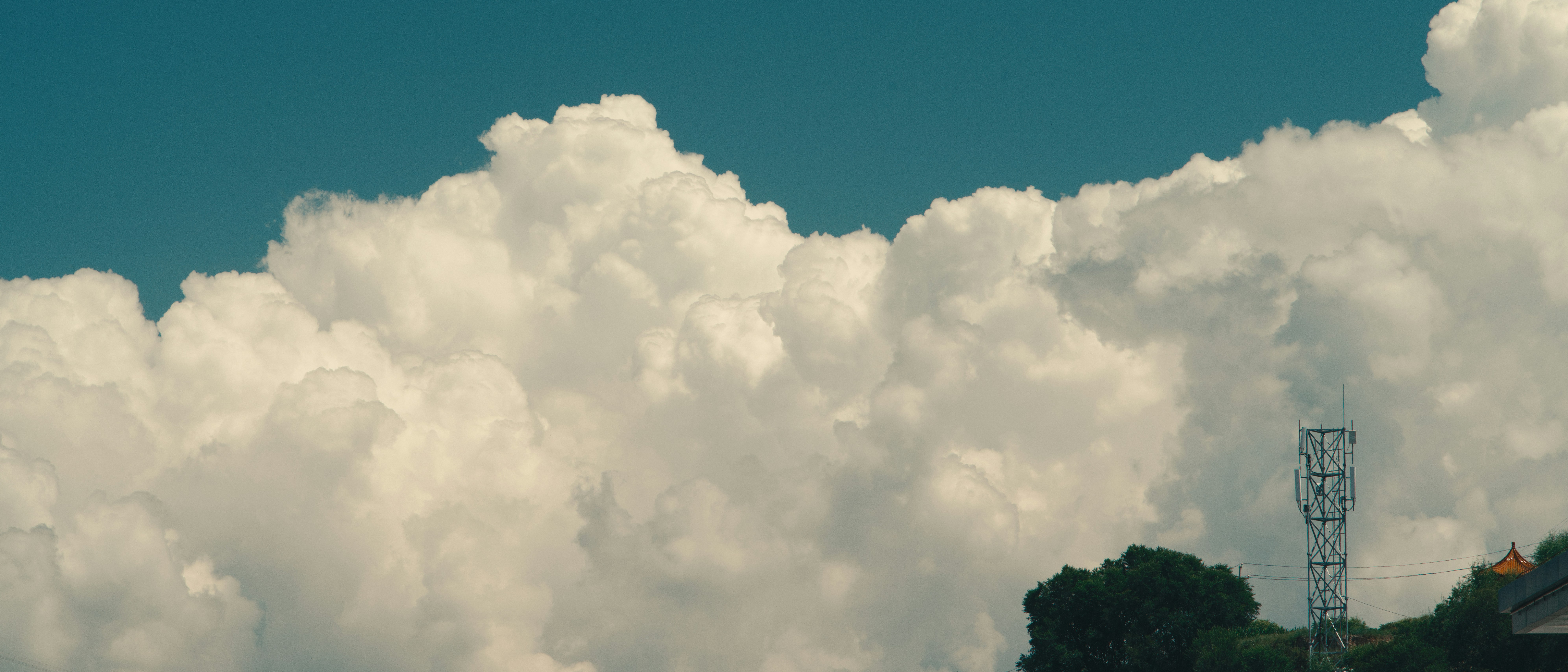 Cloudscape Over the Ridge: A Quiet Radio Tower at Dusk