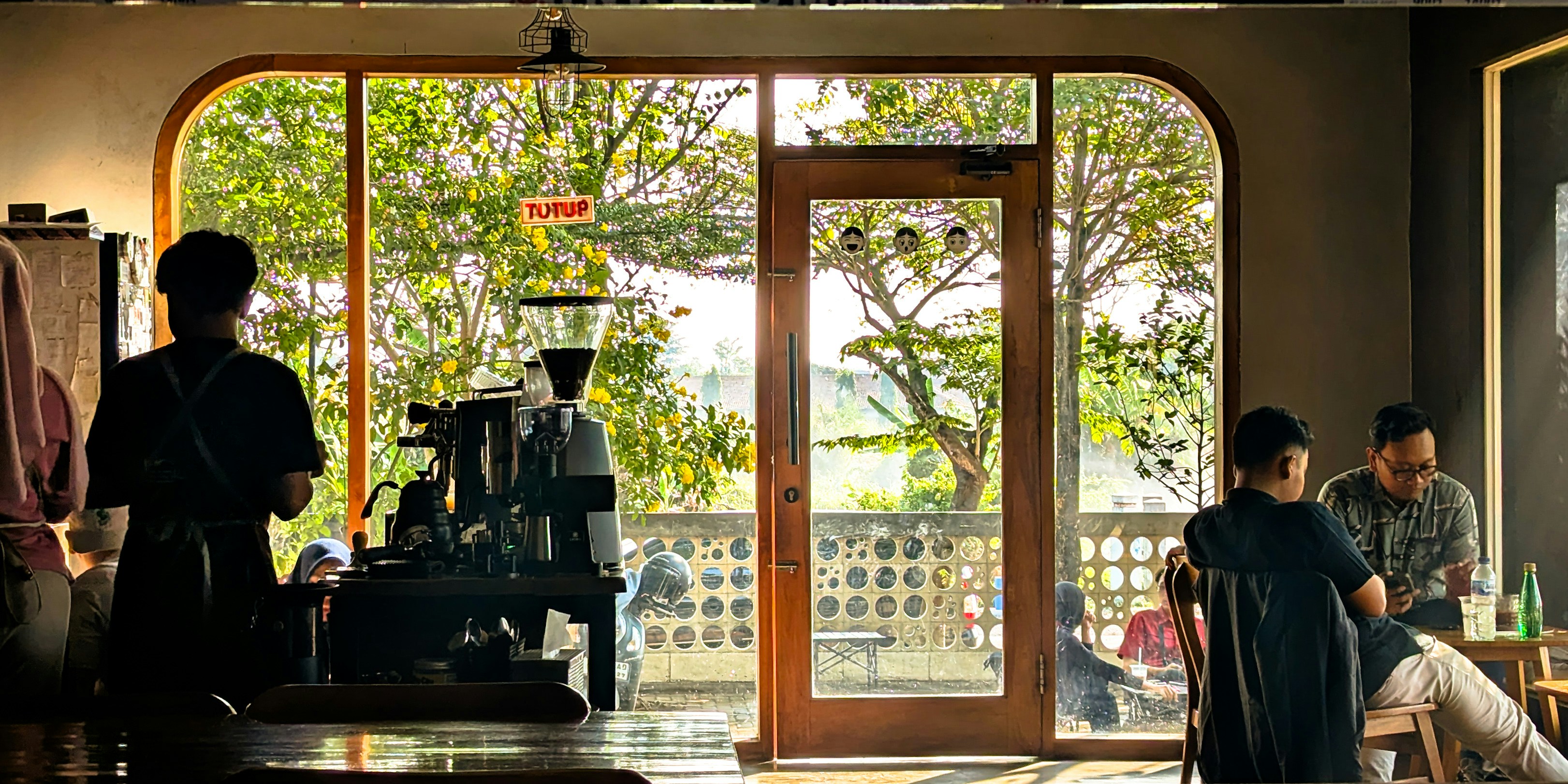 Café Quiet: Morning Light Through Glass Doors