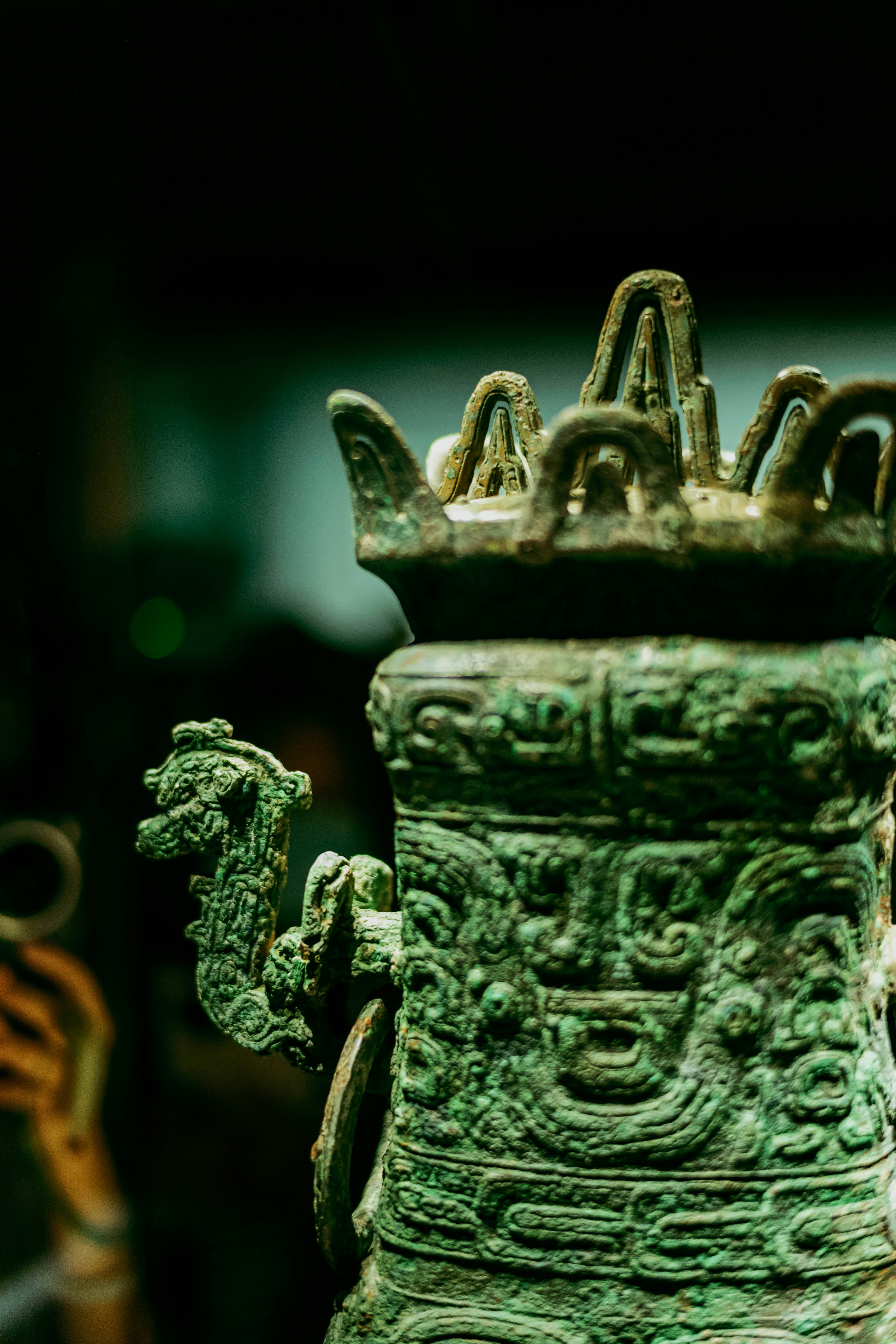 Ancient Crowned Vessel: A Weathered Ritual Urn in Focus
