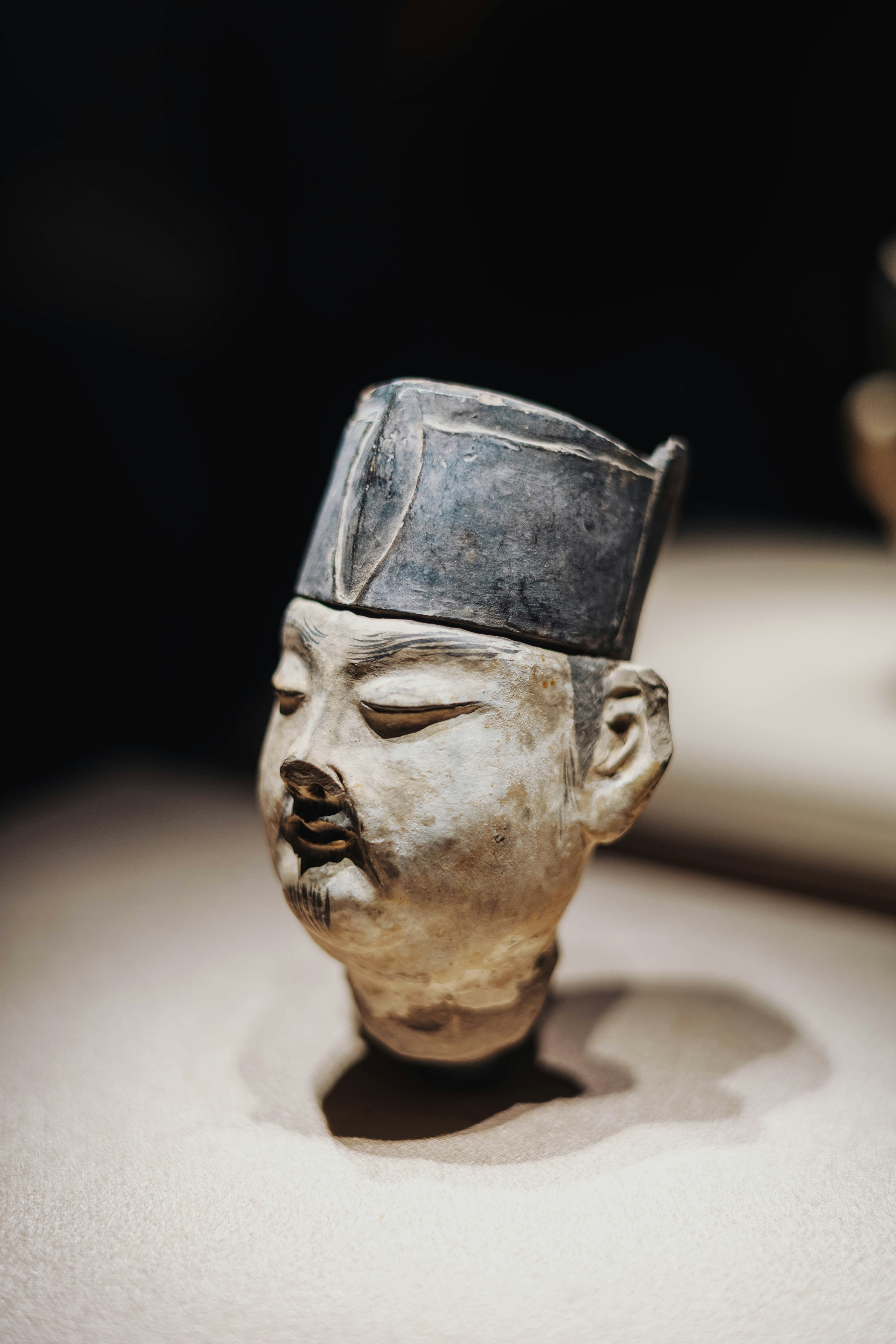 Whispered Serenity: A Ceramic Bust Beneath Northern Light