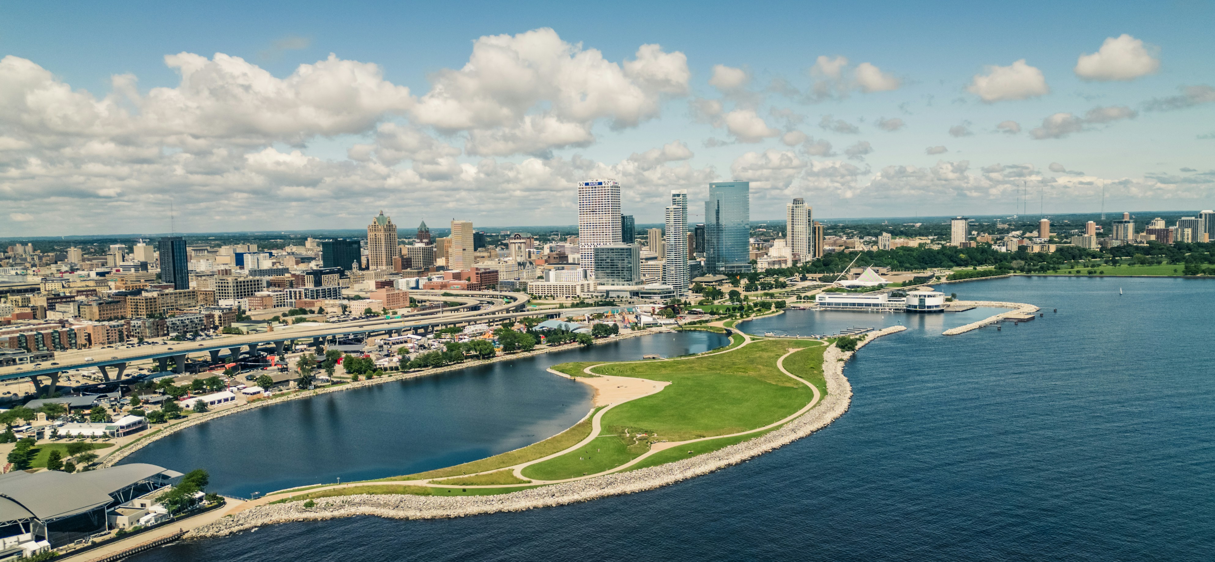 Riverside Cityscape: Aerial Park Arc Adjoins the Skyline