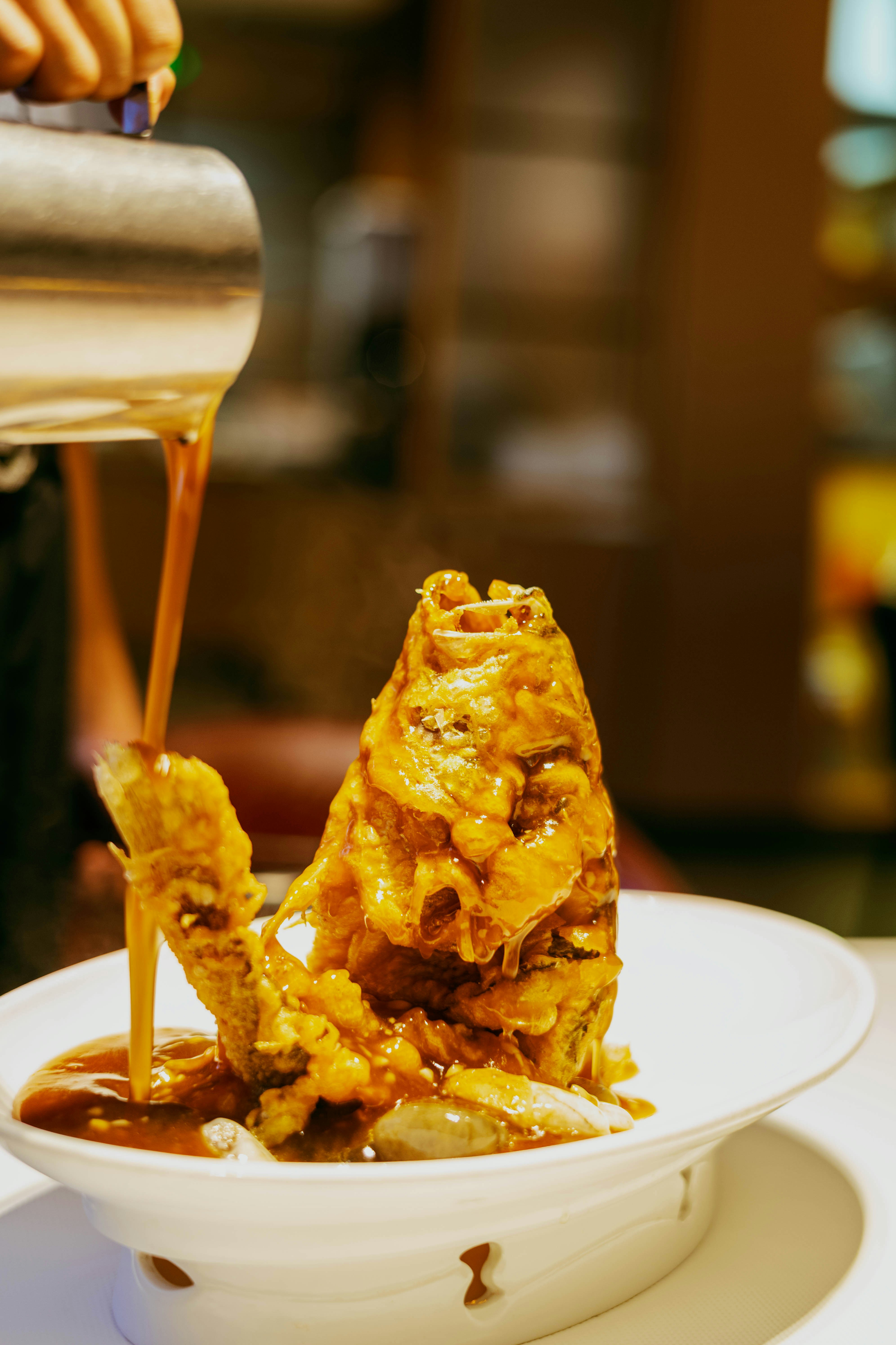 Liquid Gold Harmony: Crispy Chicken Descends into a River of Sauce