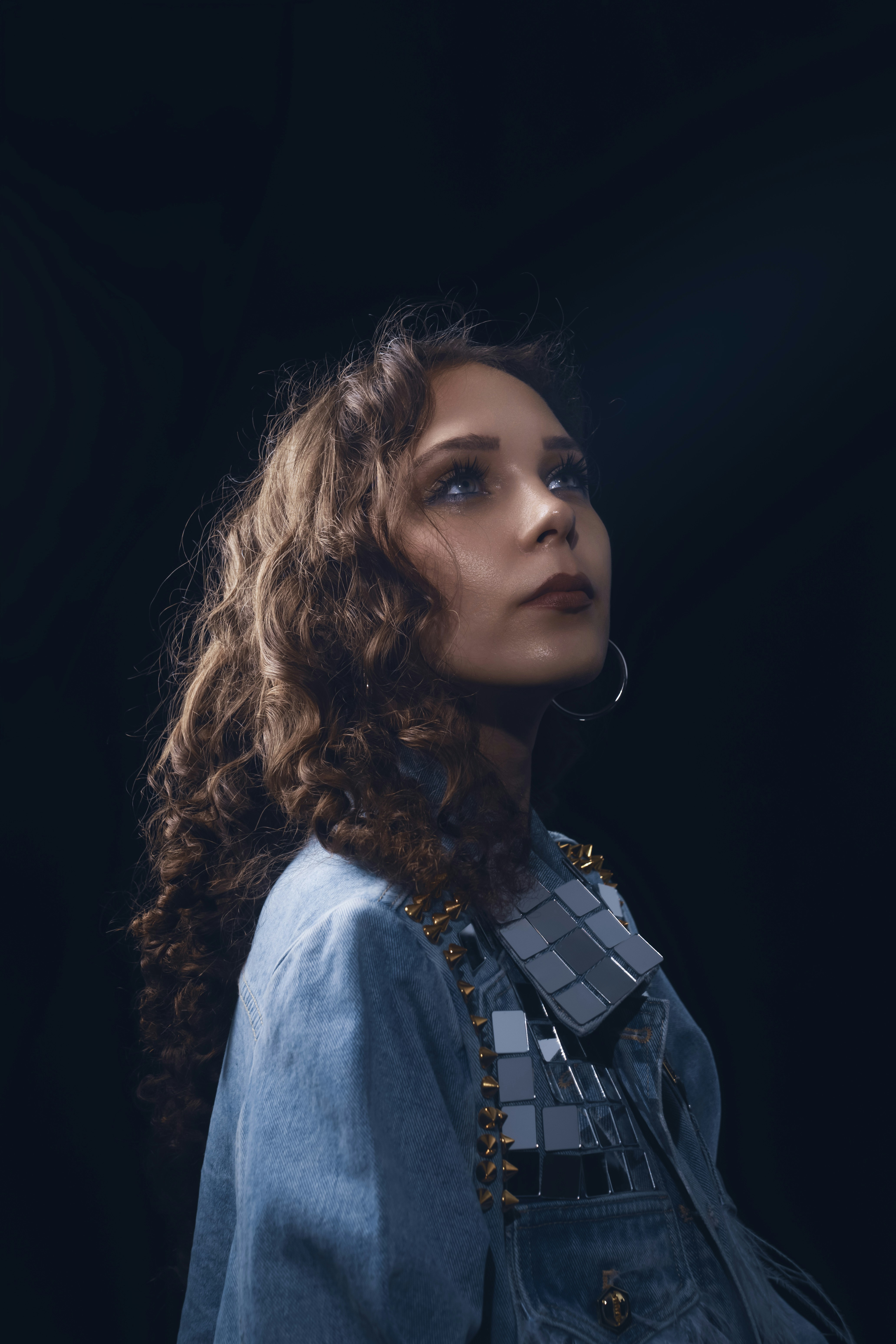 Midnight Spotlight: A Portrait Adrift in Soft Darkness