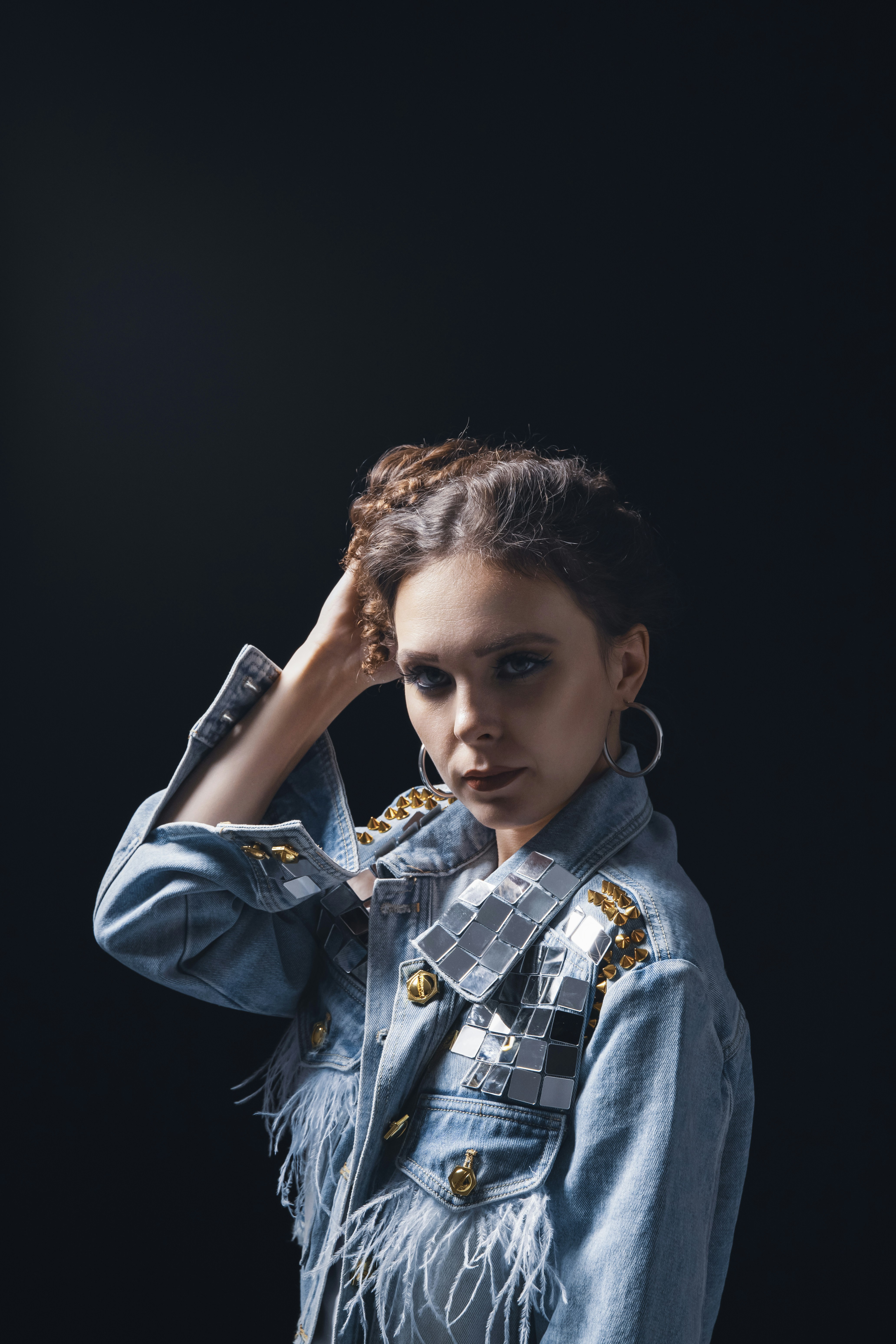 Denim Reflections: A Poised Portrait with Metallic Accents