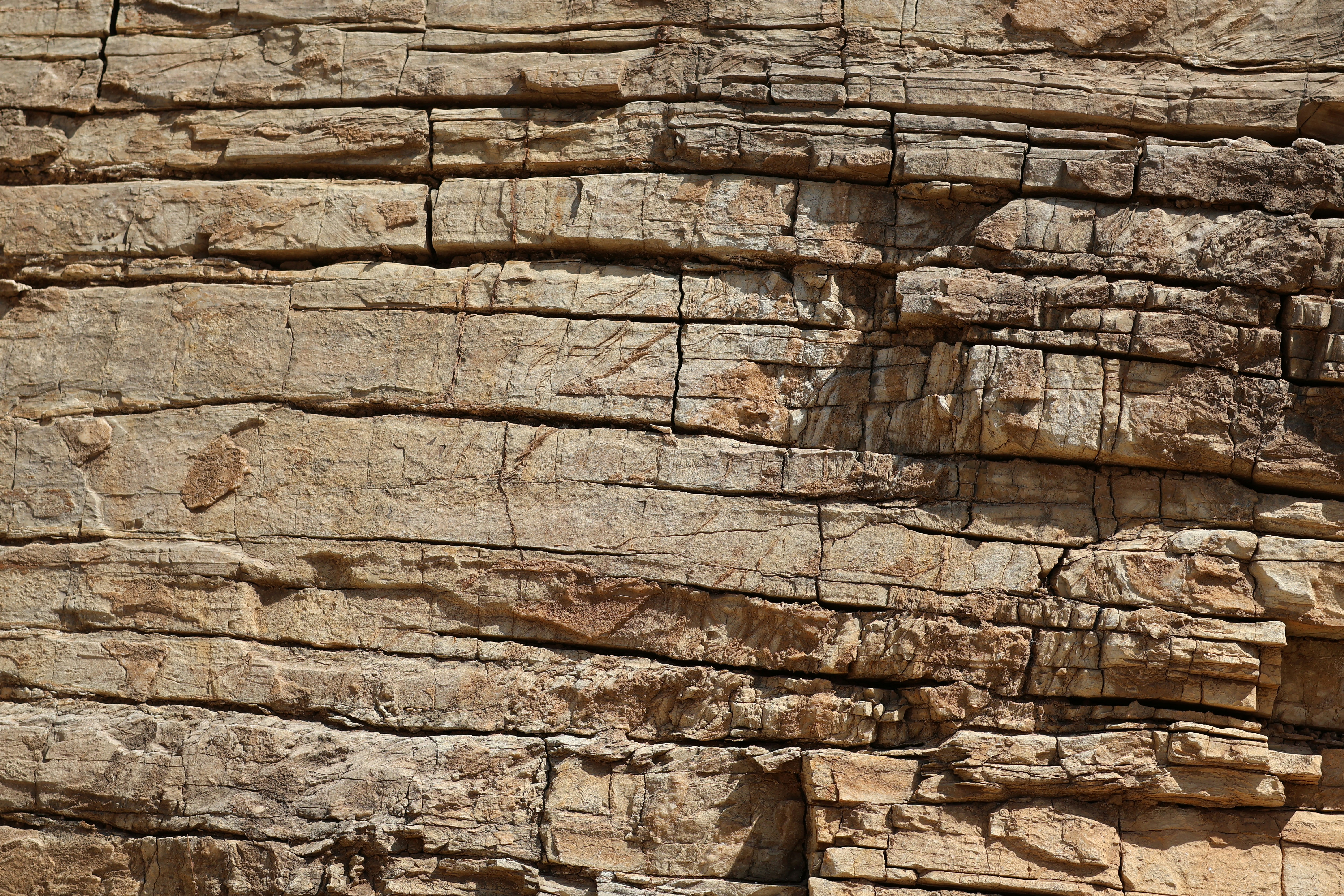 Layered Cliffs: Weathered Strata and Subtle Shadows