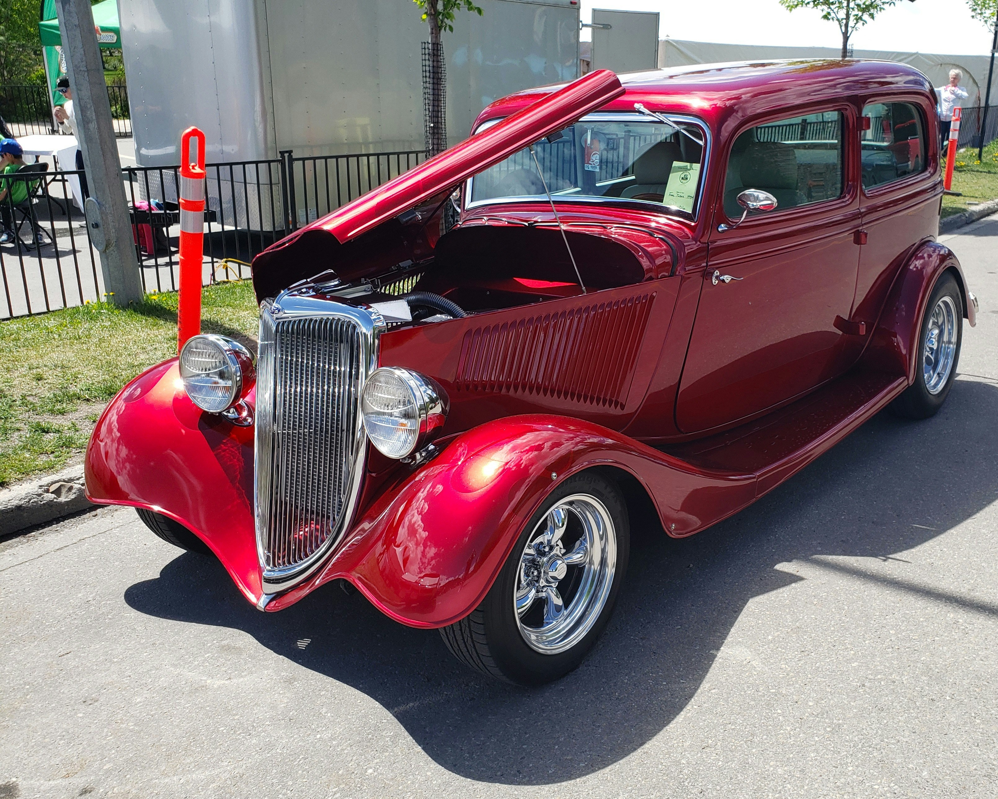 Crimson Classic: Hood Open to Showcase Chrome Grille and Veloce Lines