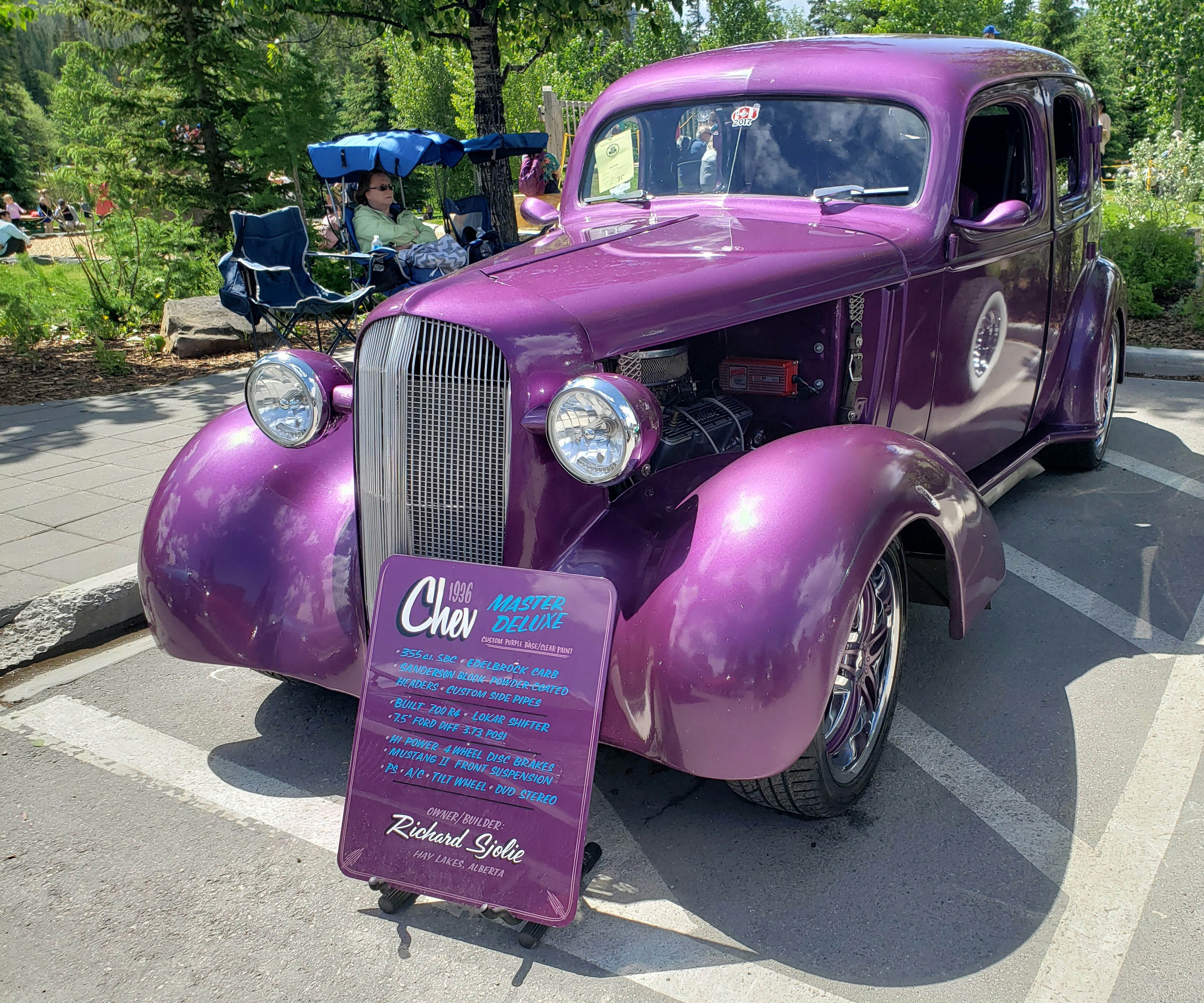 Violet Classic: A 1930s Sedan Resting in the Spotlight