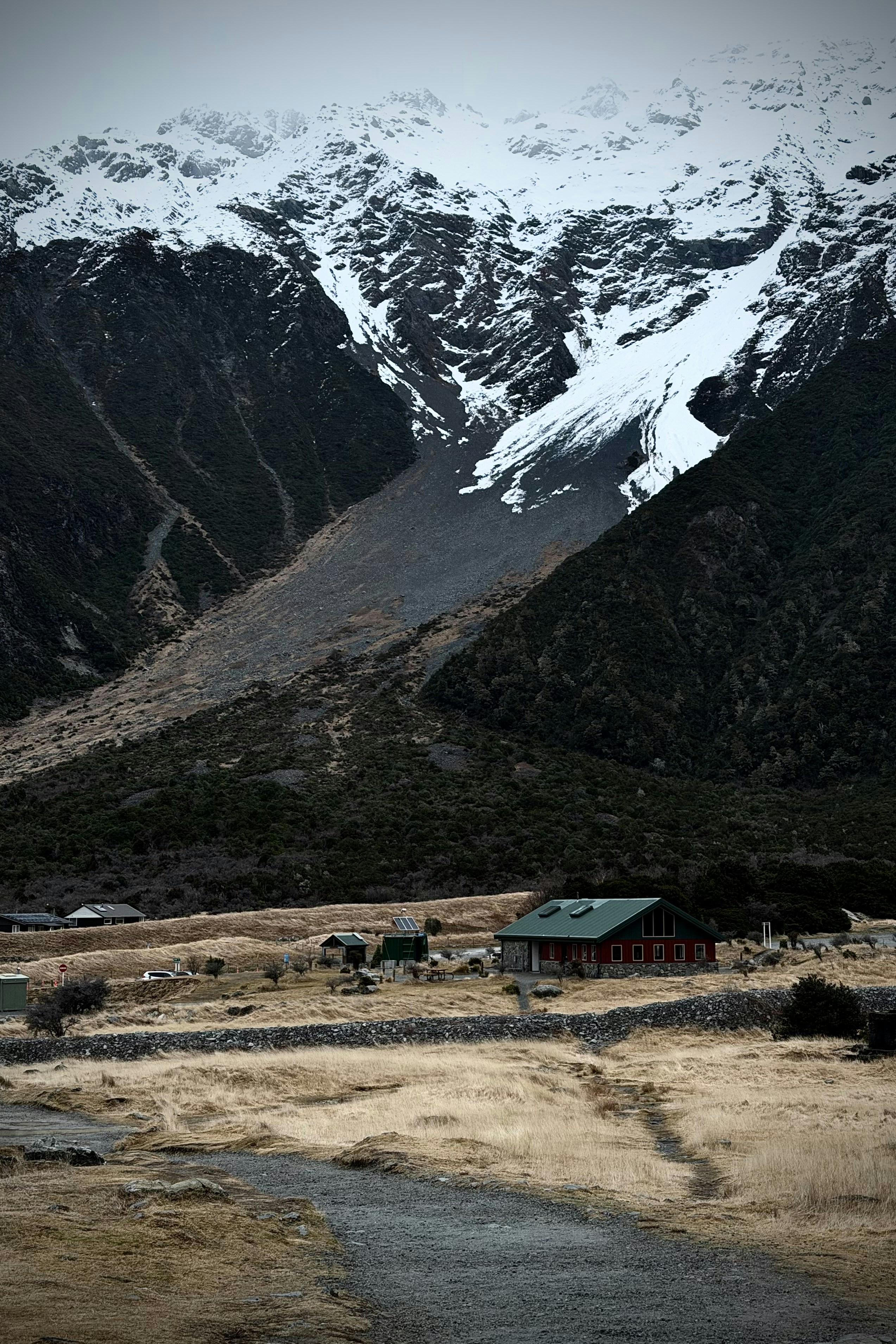 Snowbound Valley Lodge at the Foot of a Ghostly Range
