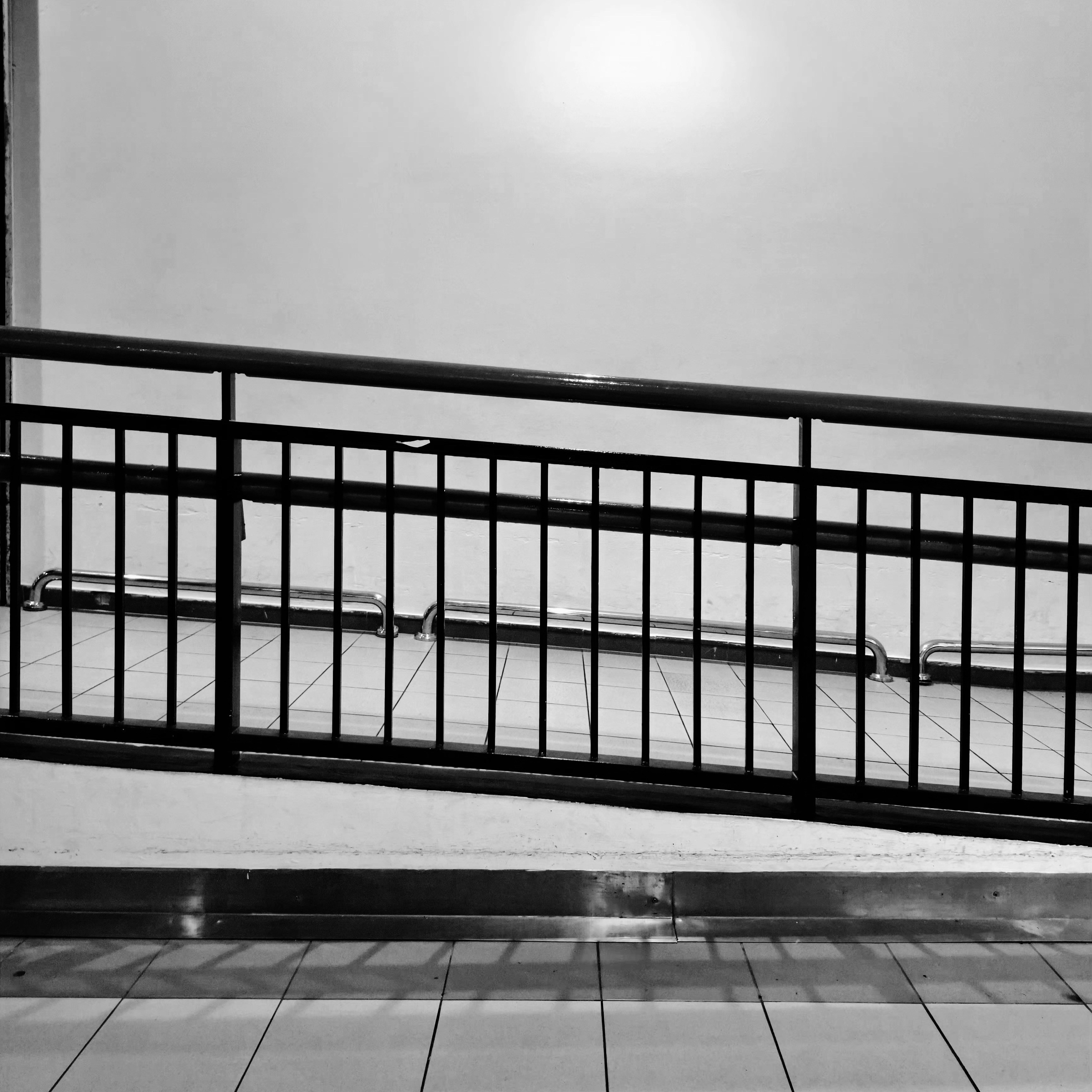 Monochrome Balcony Rail Leading to Quiet Floor