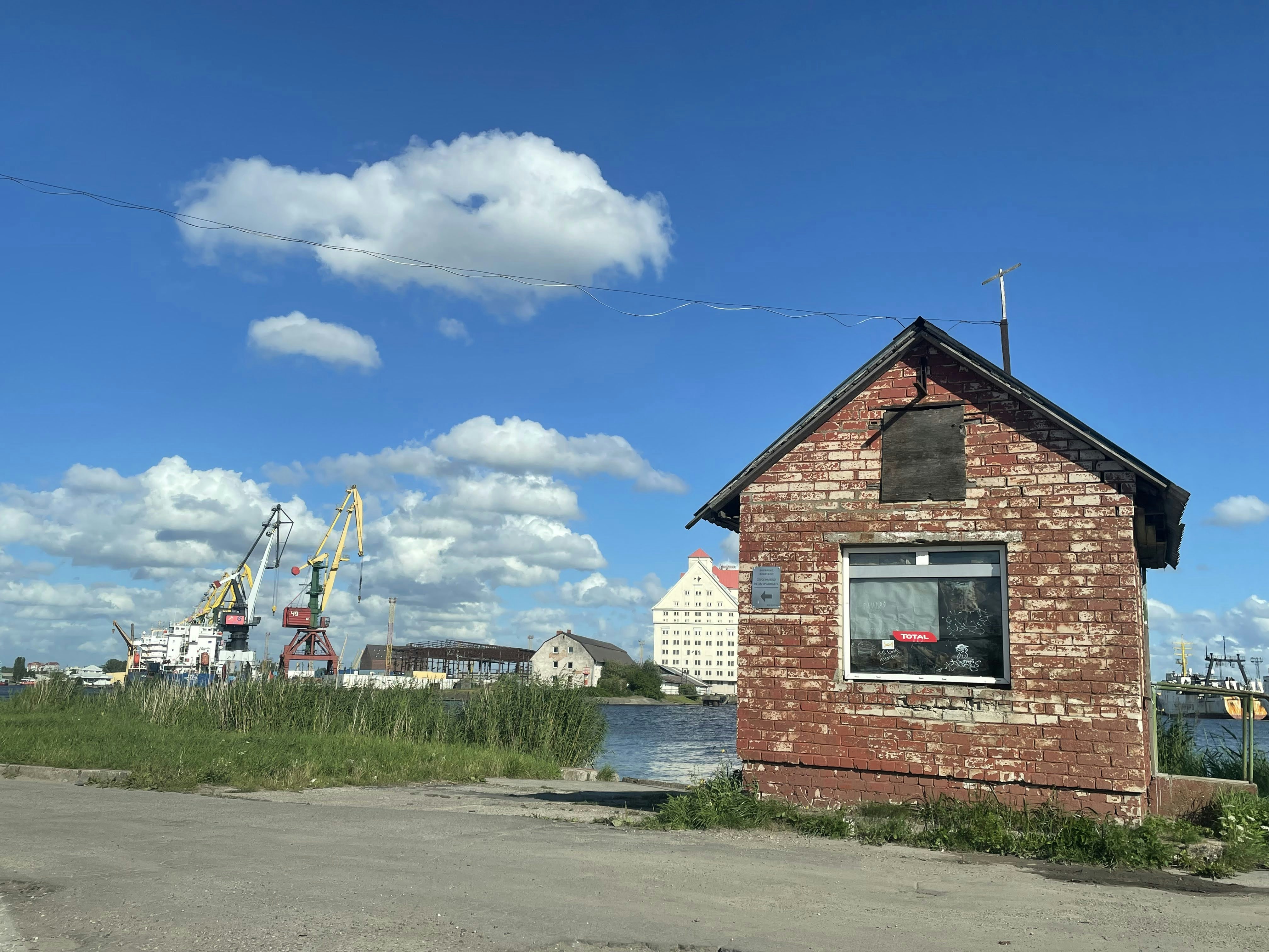 Brick Shed on the Waterfront Under a Brisk Blue Sky