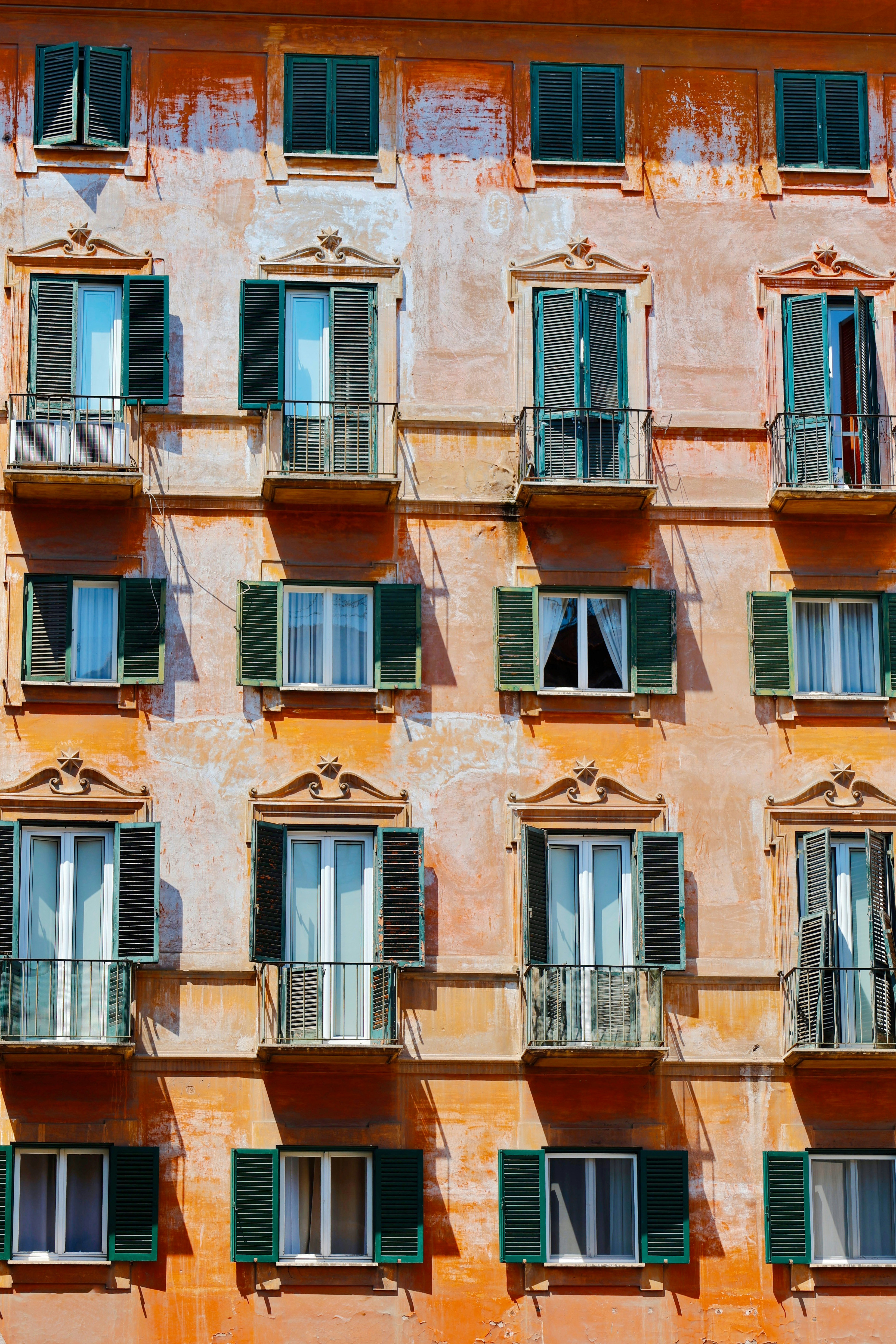 Sunlit Facade with Shuttered Windows