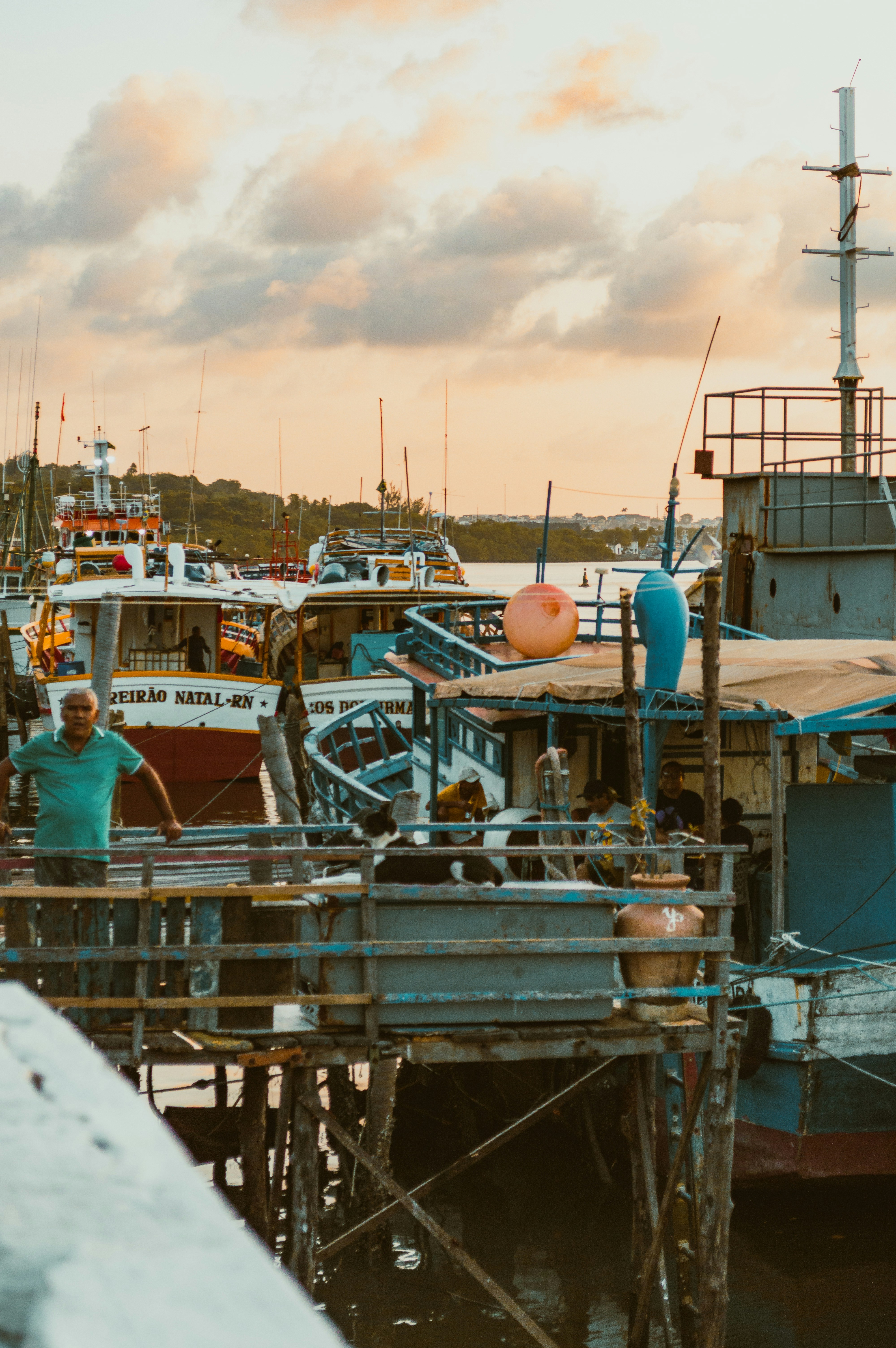 Harbor Docks at Golden Hour: Boats, Wood, and People