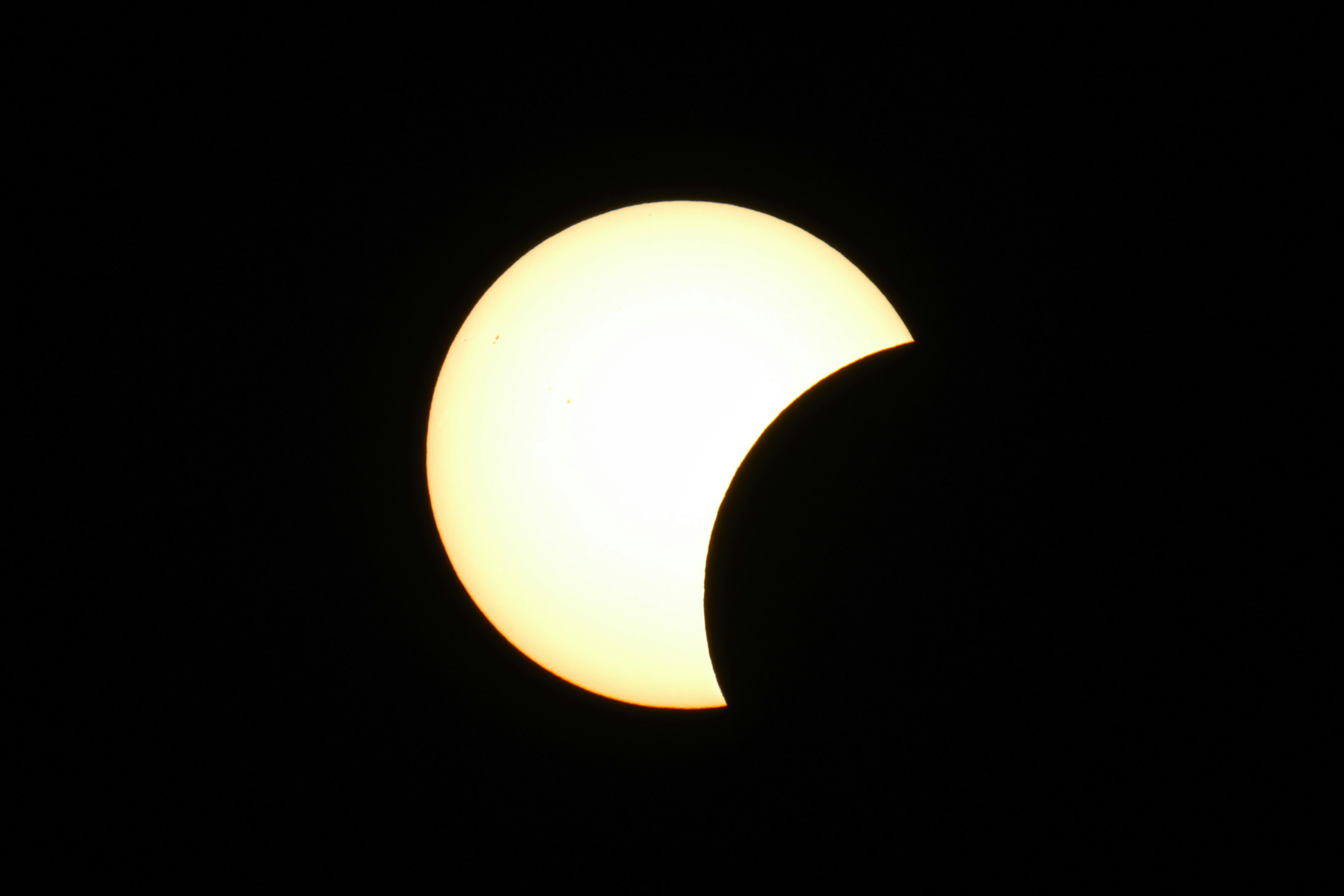 Crescent Eclipse: A Solar Cutout in Night