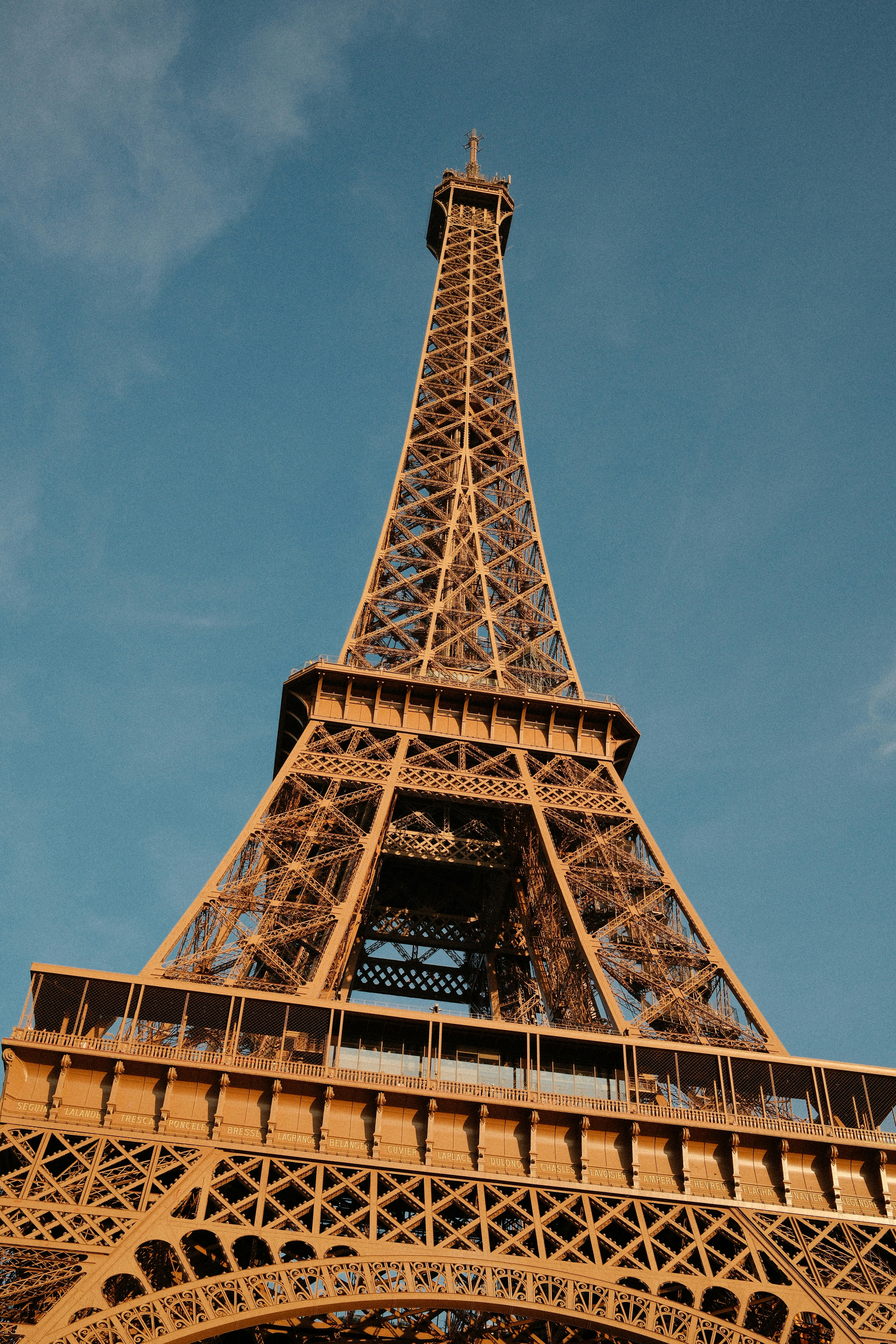 Iron Lacework Reaching the Blue: The Eiffel Tower from a Low Perspective